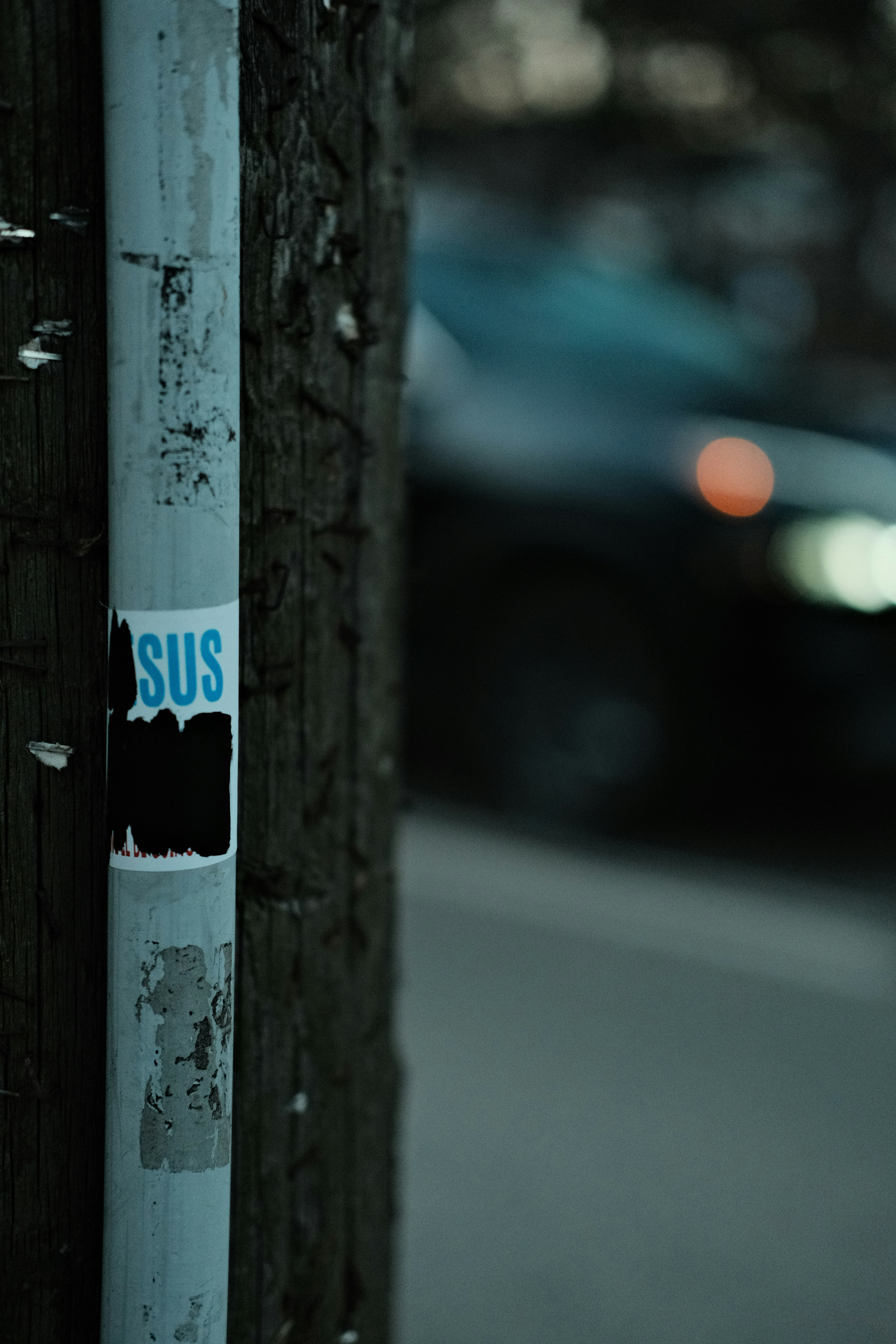 a close up of a pole on a city street