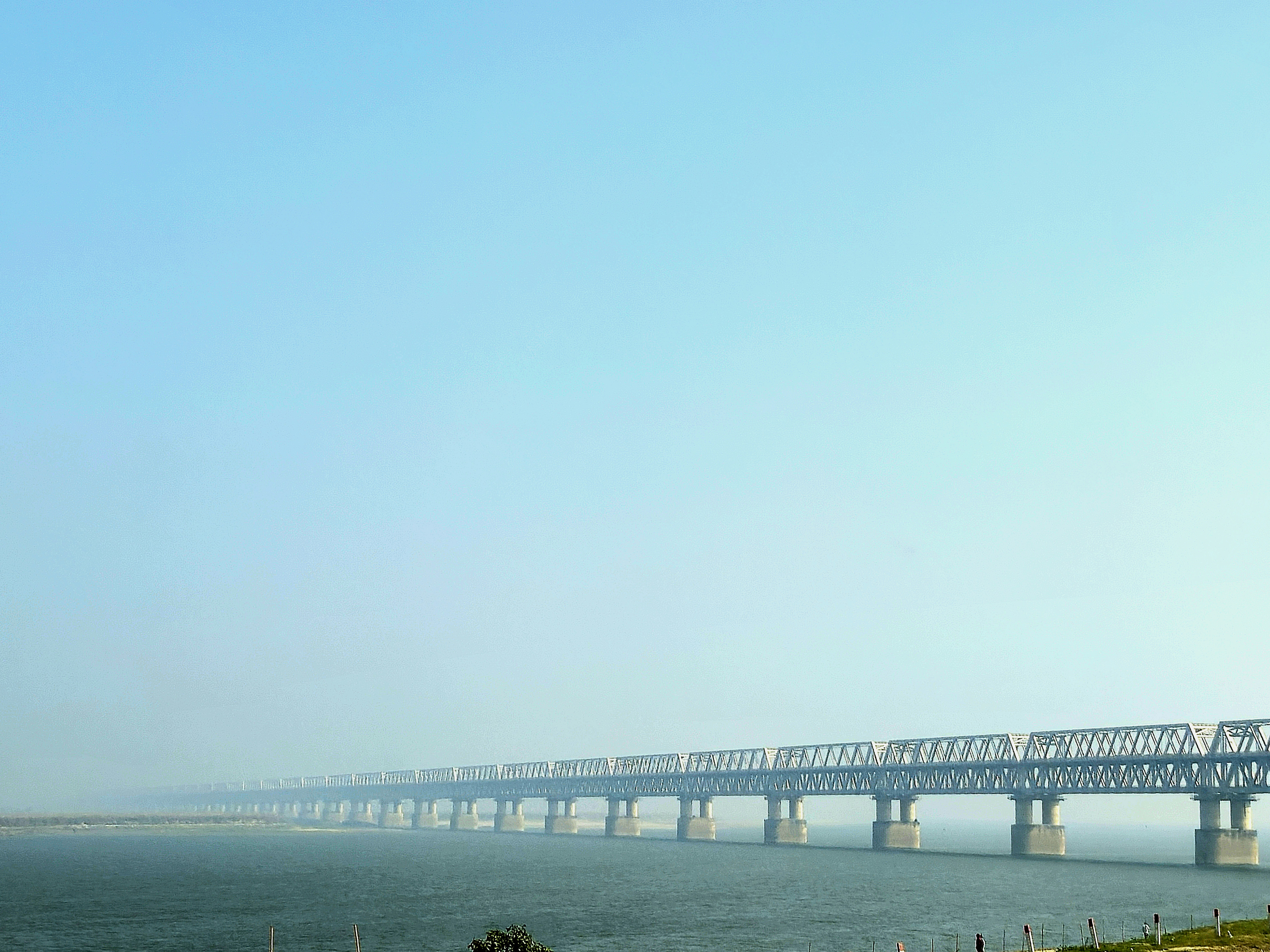 A long bridge over a large body of water photo – Free Bridge Image on ...