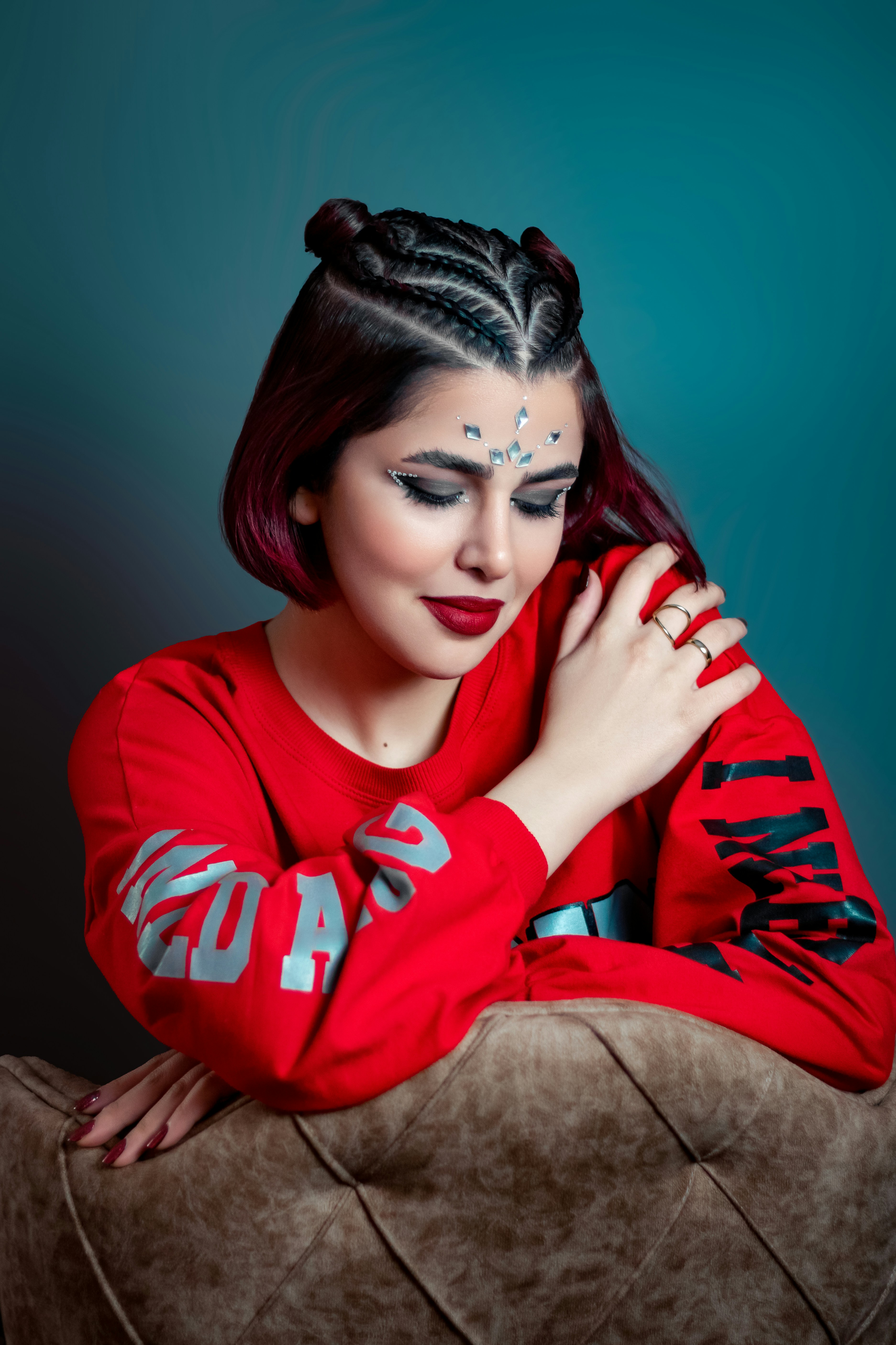 Crimson Portrait: Glass Jewels and Braids in Velvet Glow