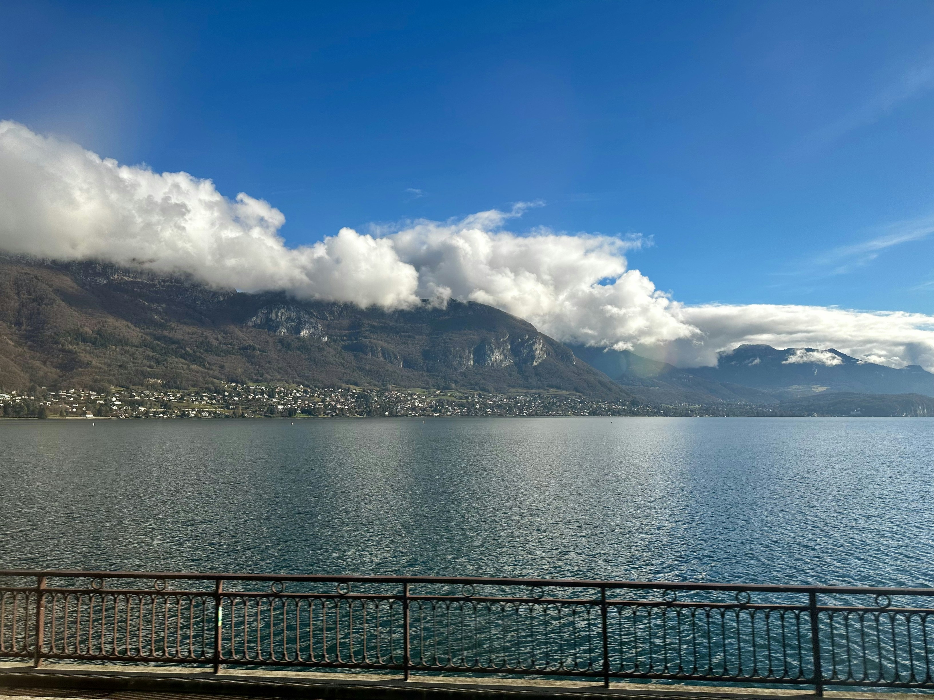 Azure Lake Beneath Cloud-Scalloped Peaks