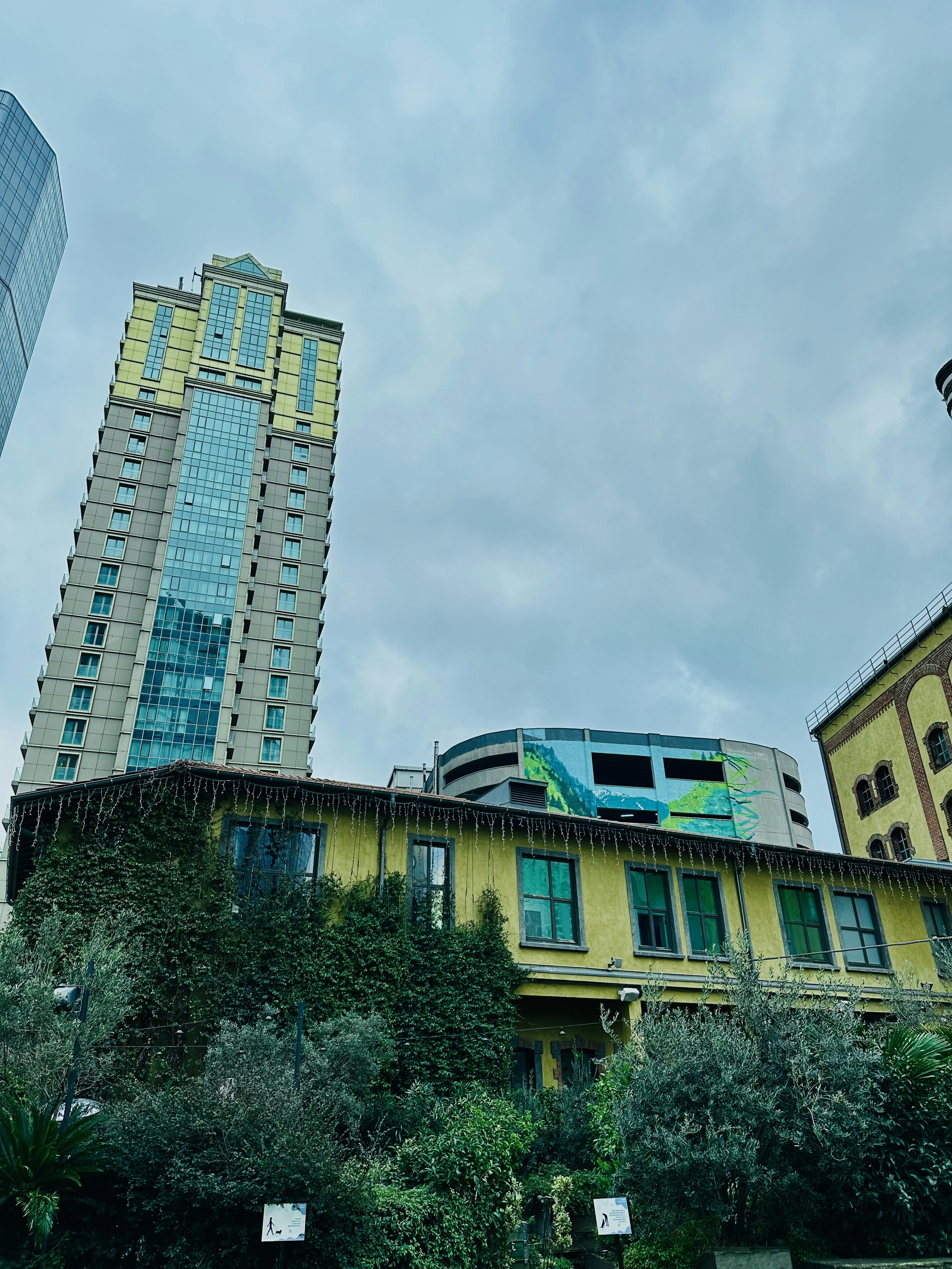 A tall building with a train on top of it photo – Free Cityscape Image ...