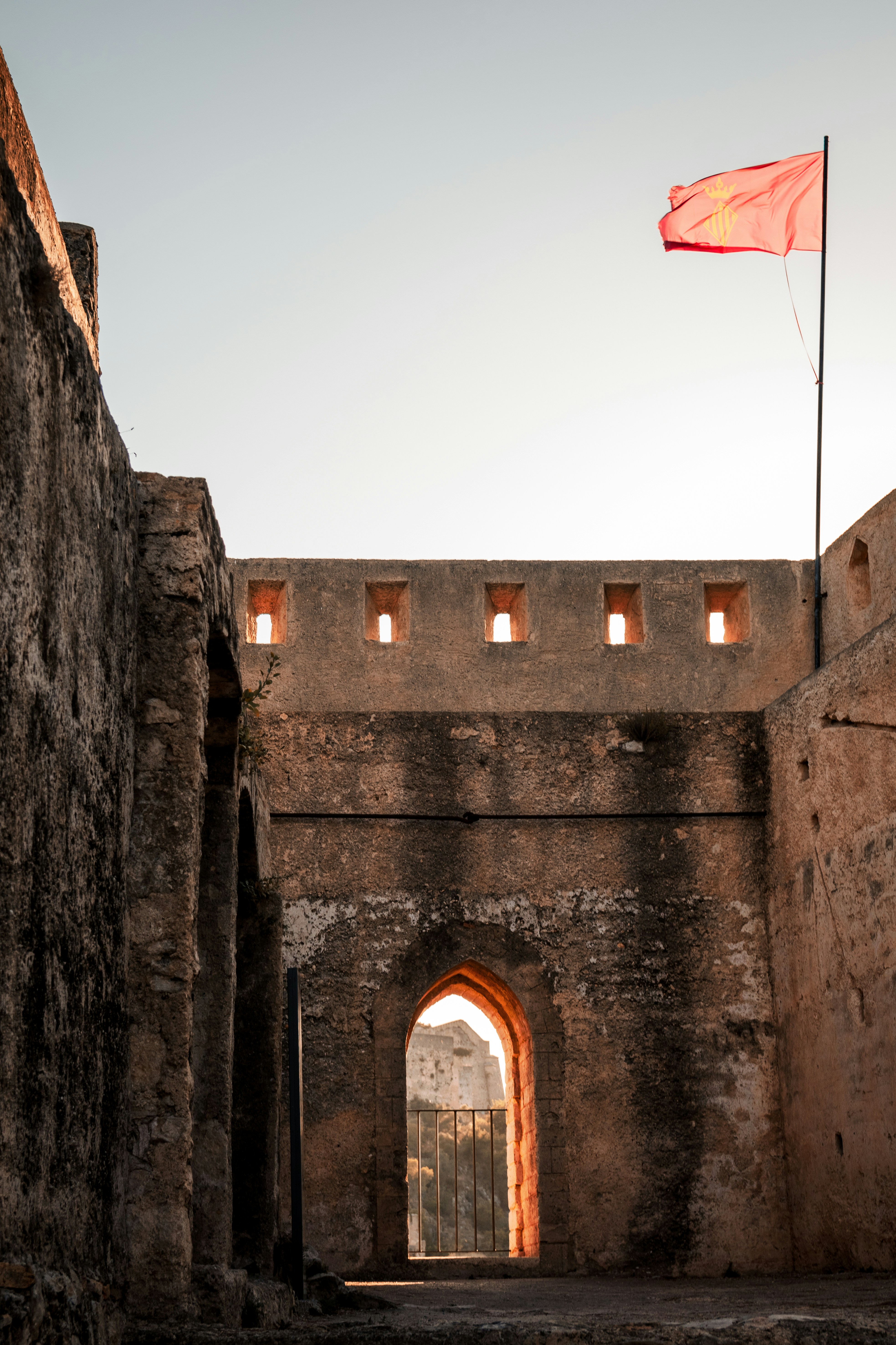 Crimson Flag Above the Dusk Archway Fortress