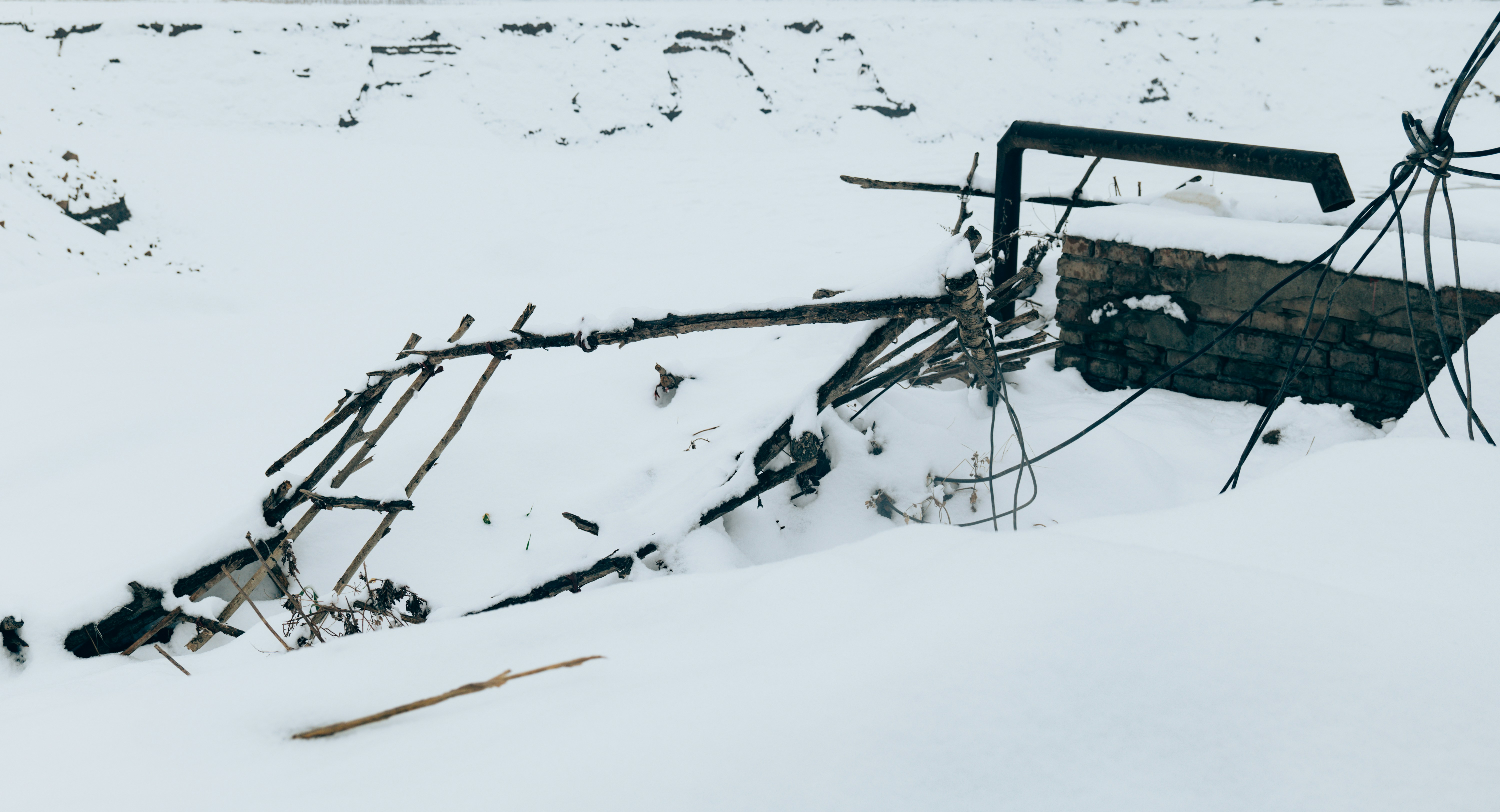 Snowbound Wreckage: A Fractured Frame Emerges in the Quiet Snow