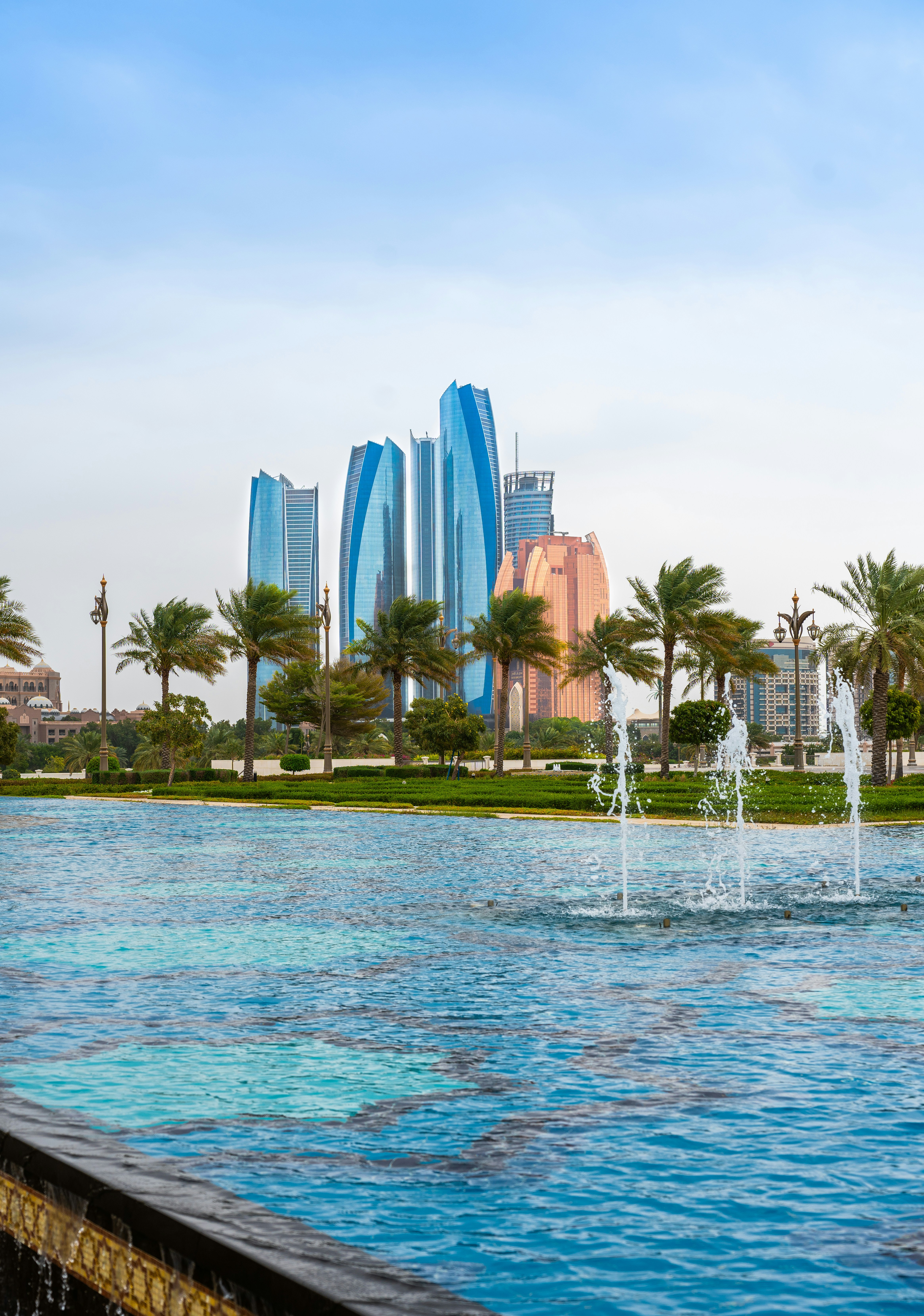 Cobalt Towers Rise Over a Palm-Lined Waterfront