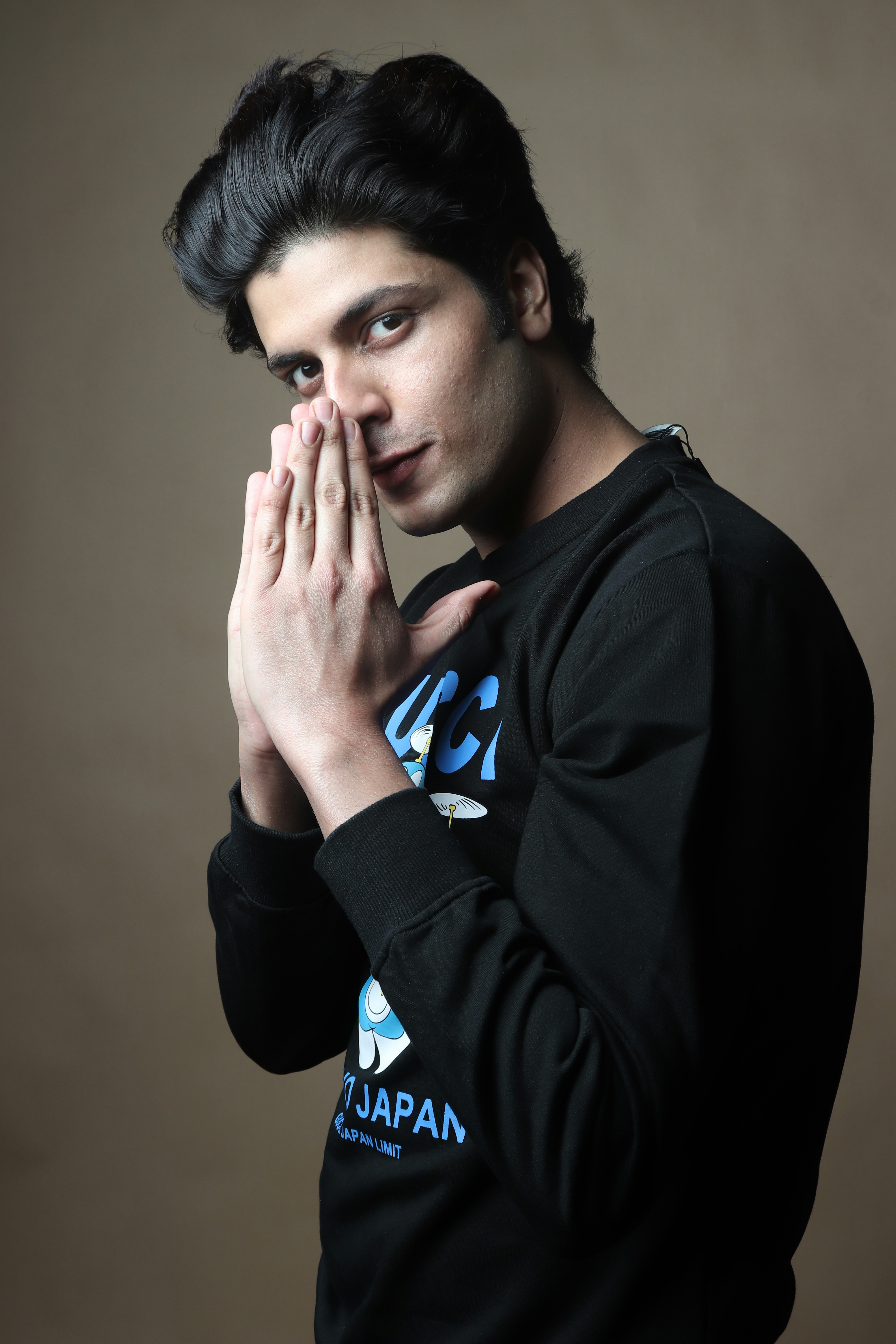 Contemplative Gaze: Fingers Closed in Prayerful Focus
