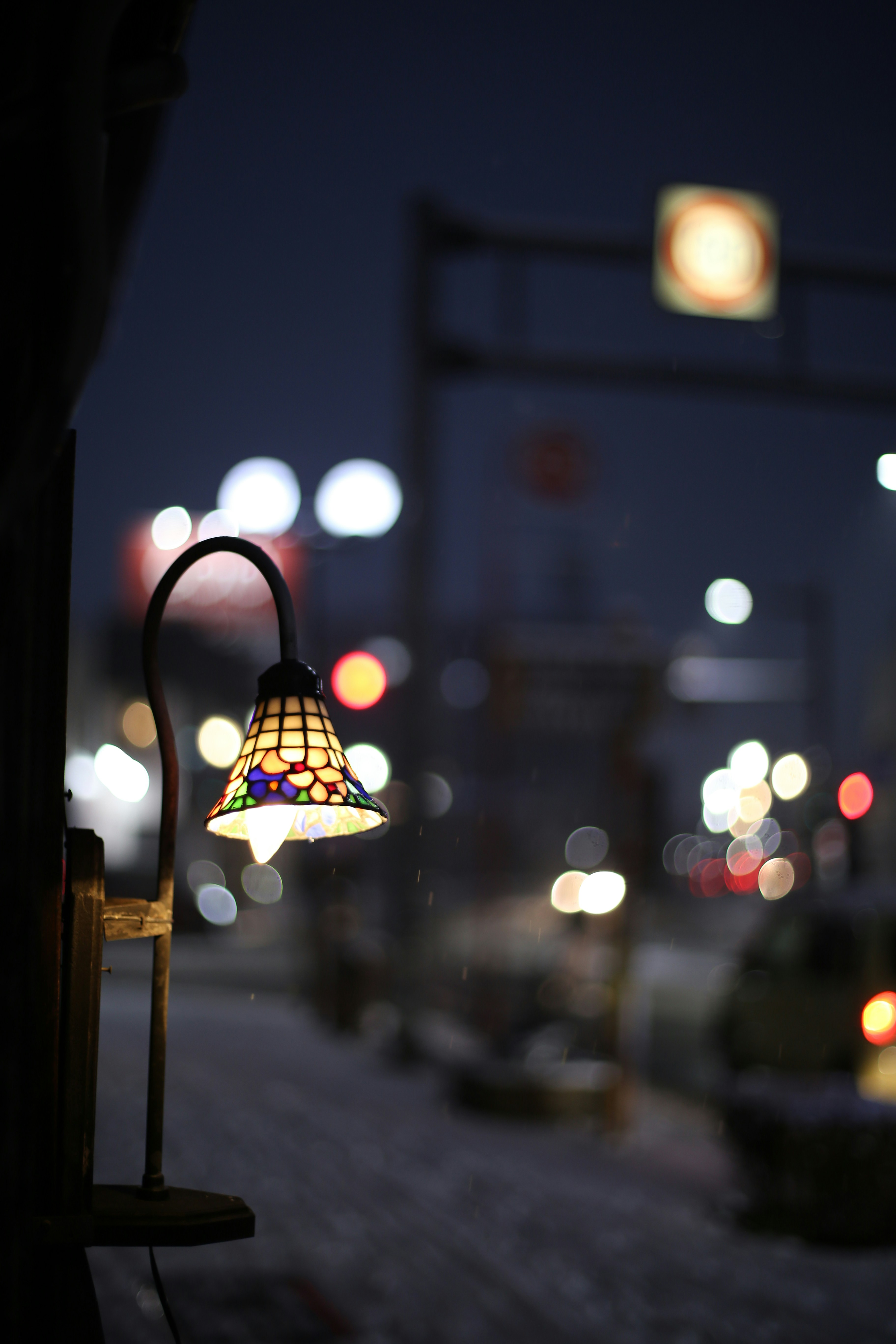 Stained-Glass Lantern in Velvet Night, Framed by City Bokeh
