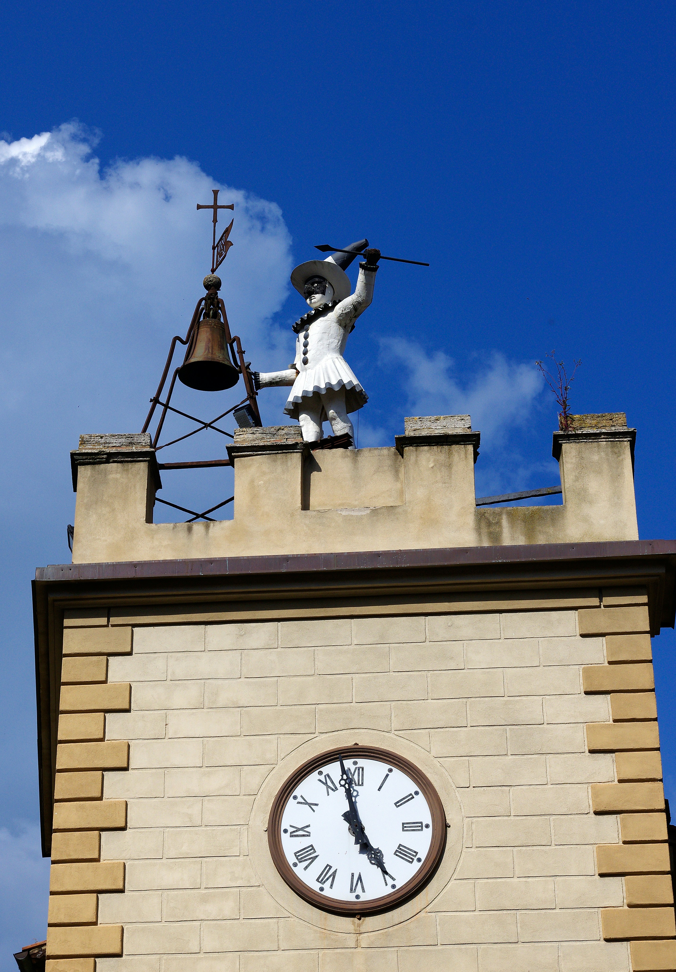 Clock Tower Sentinel: A Weathered Figure Tufting the Sky