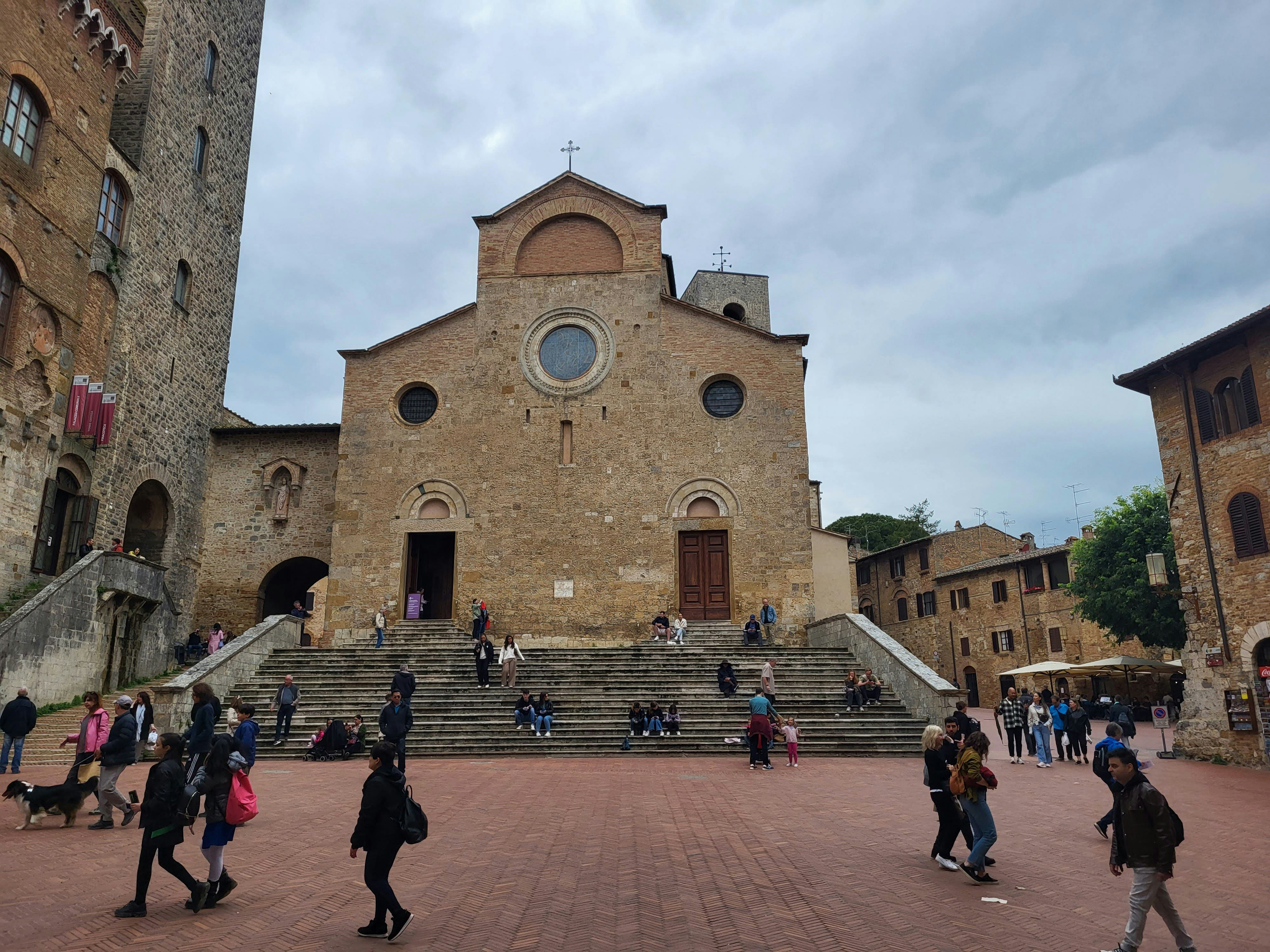 a group of people walking in front of a church