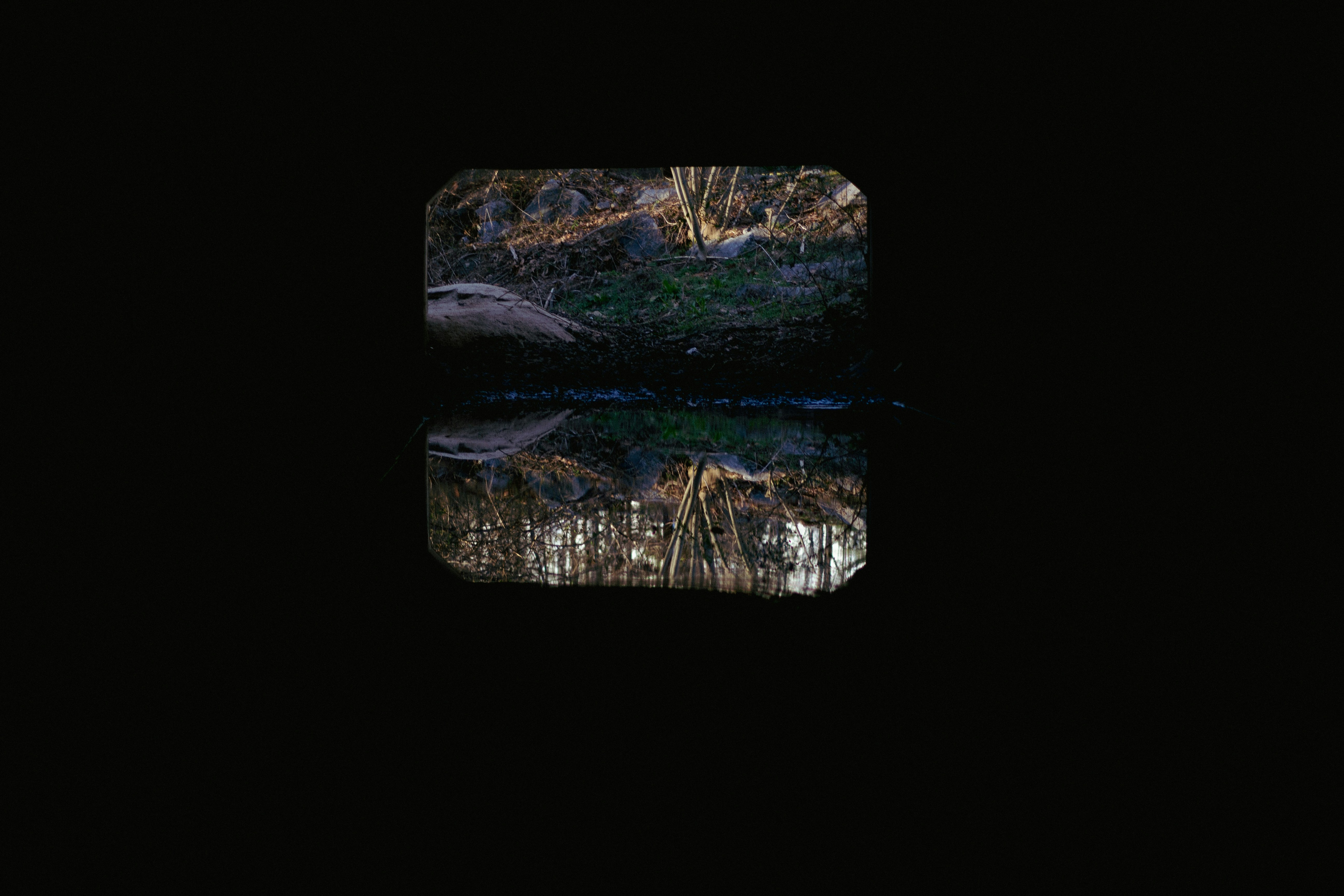 Hidden Gorge Window: Quiet Reflection in a Narrow Canyon