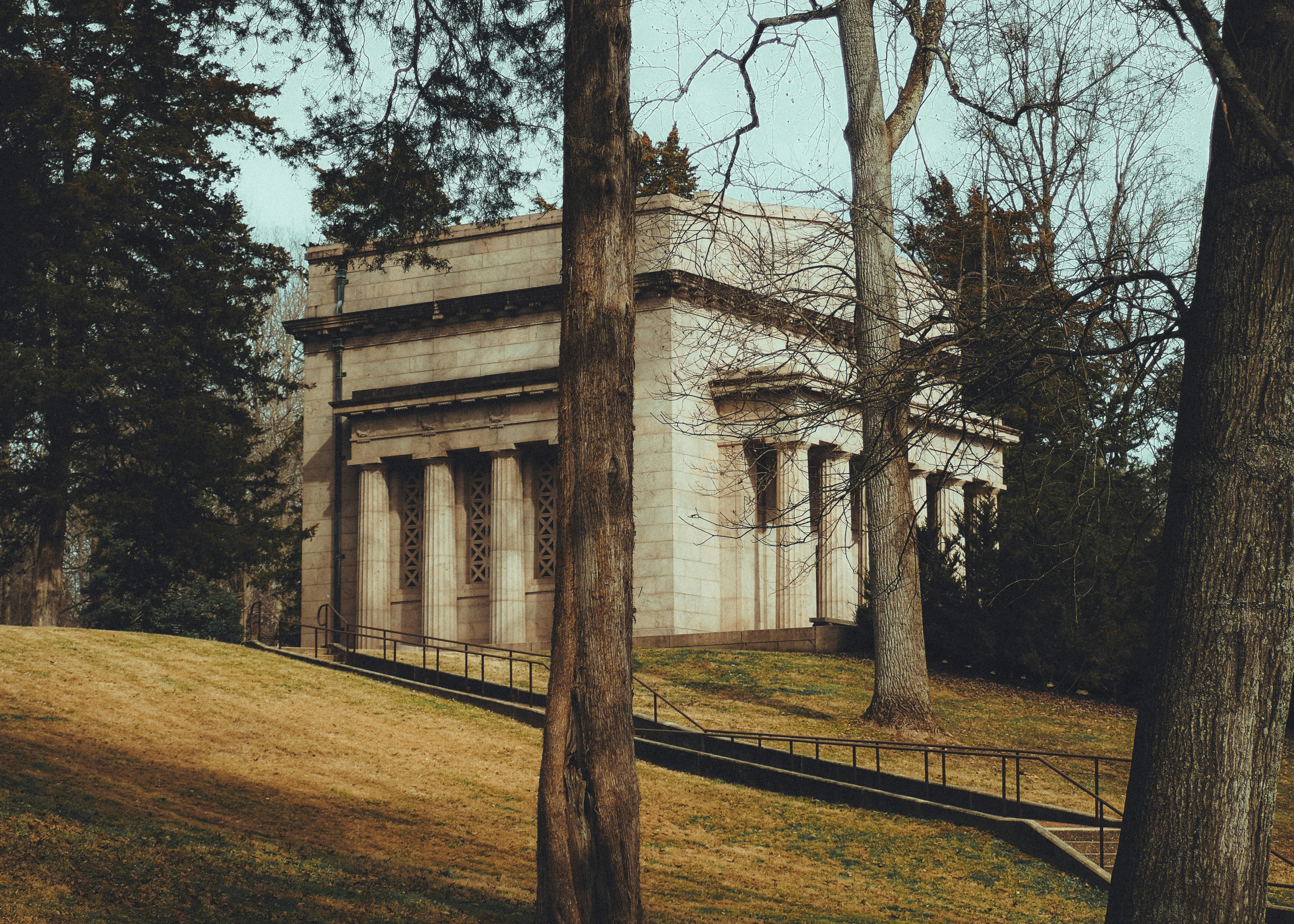 Autumn Glow Illuminates a Colonnaded Temple in a Quiet Park