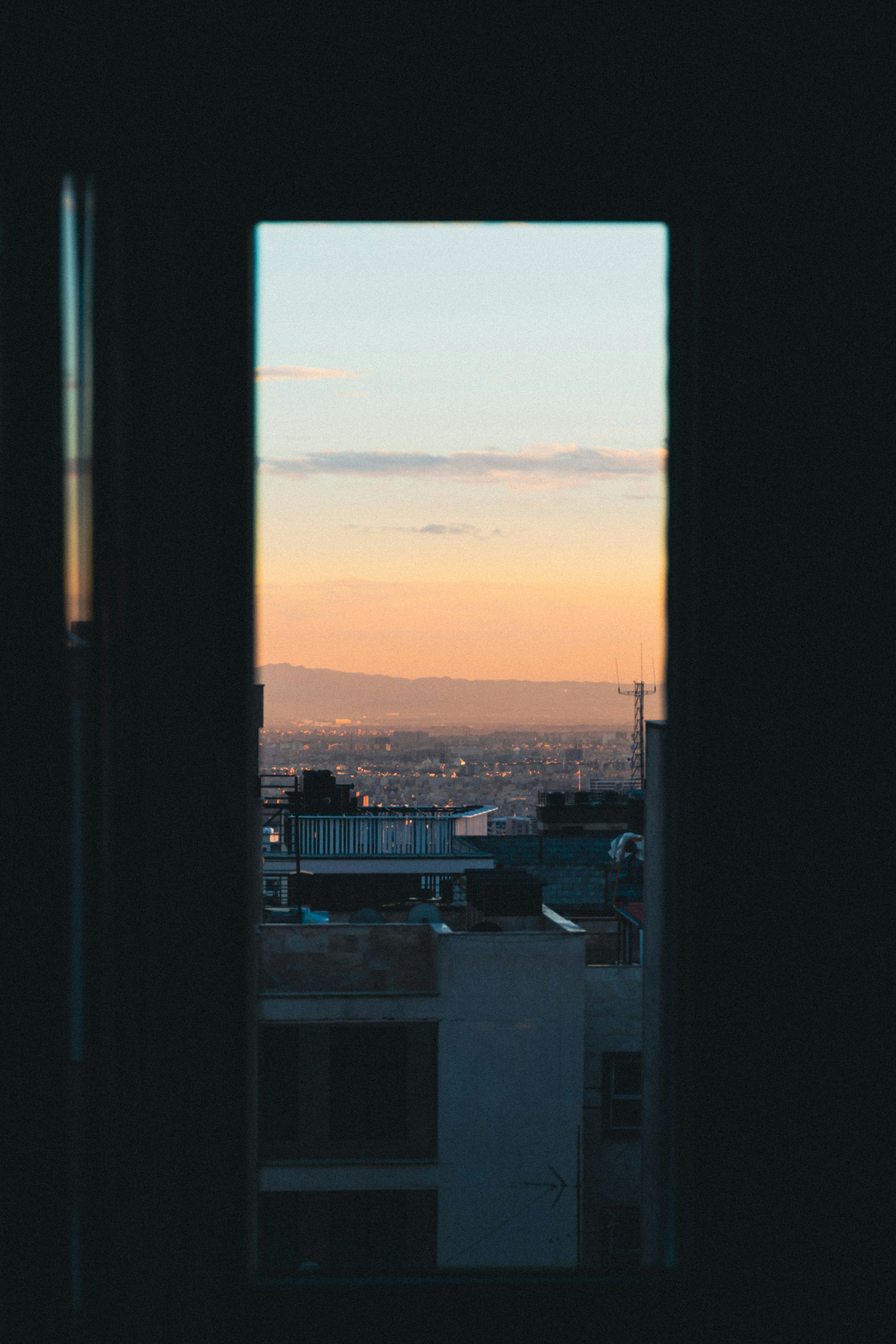 A view of a city from a window photo – Free City Image on Unsplash