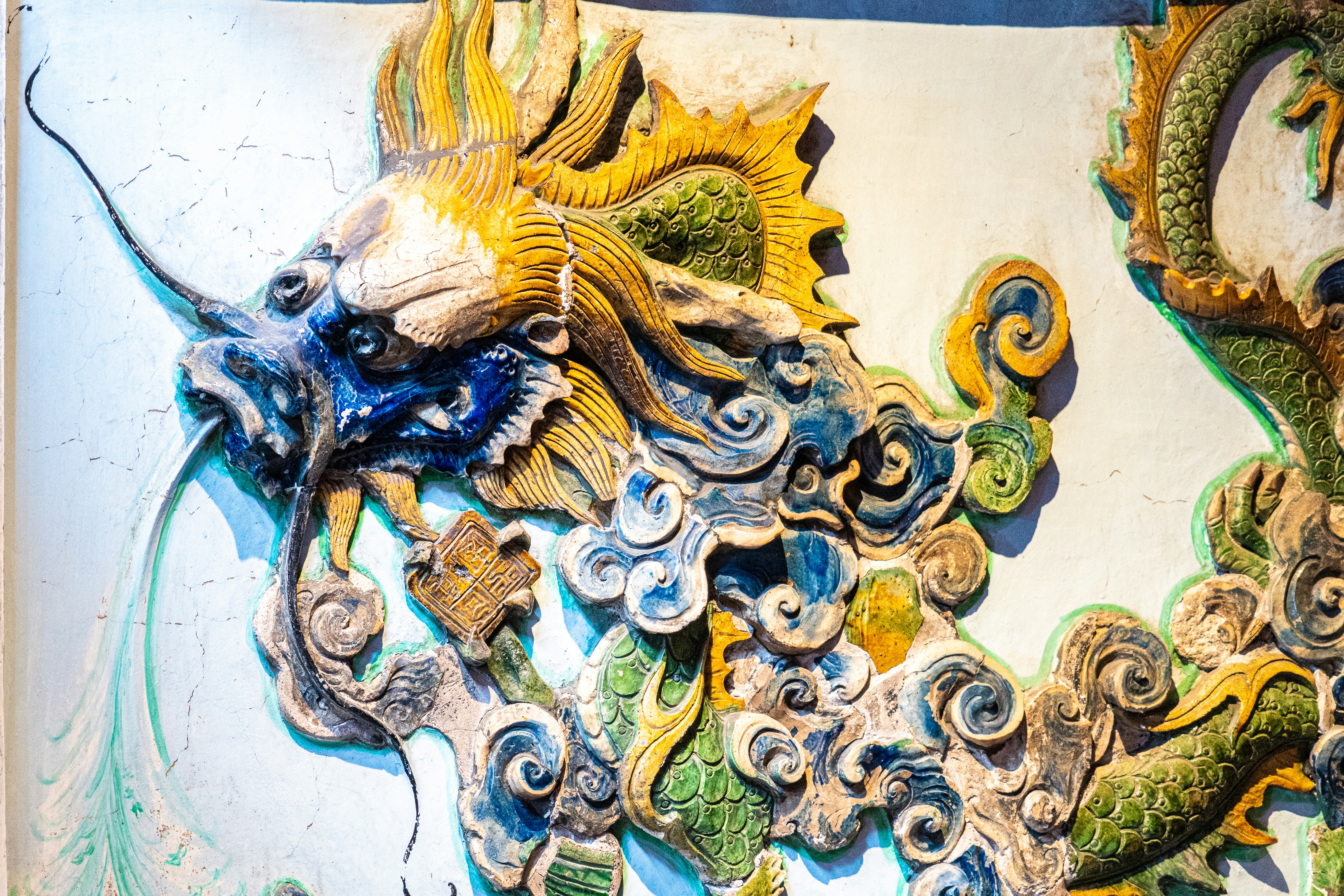 A dragon sculpture on the side of a building photo – Free Bangka ...