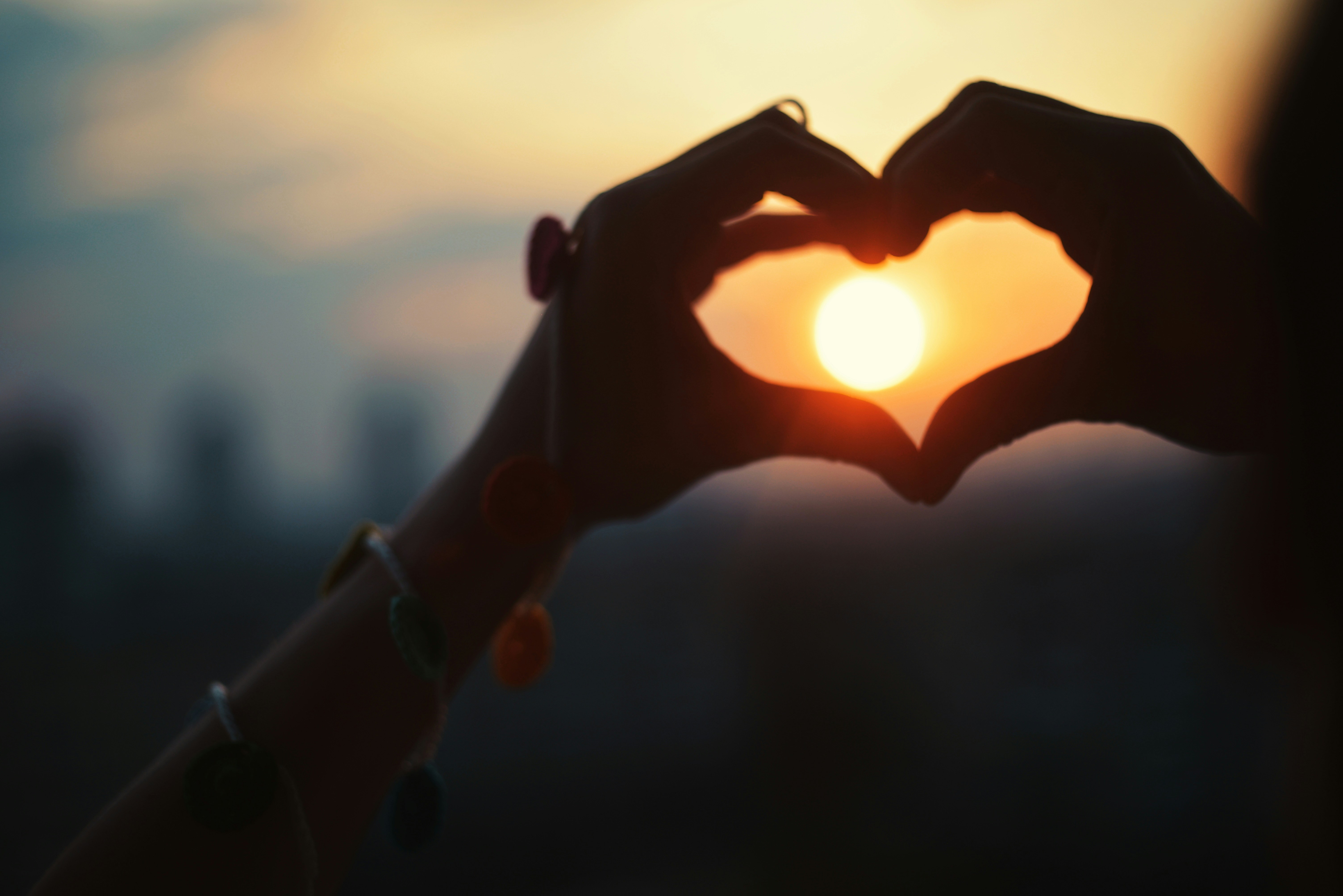 A person making a heart shape with their hands photo – Free Ukraine ...