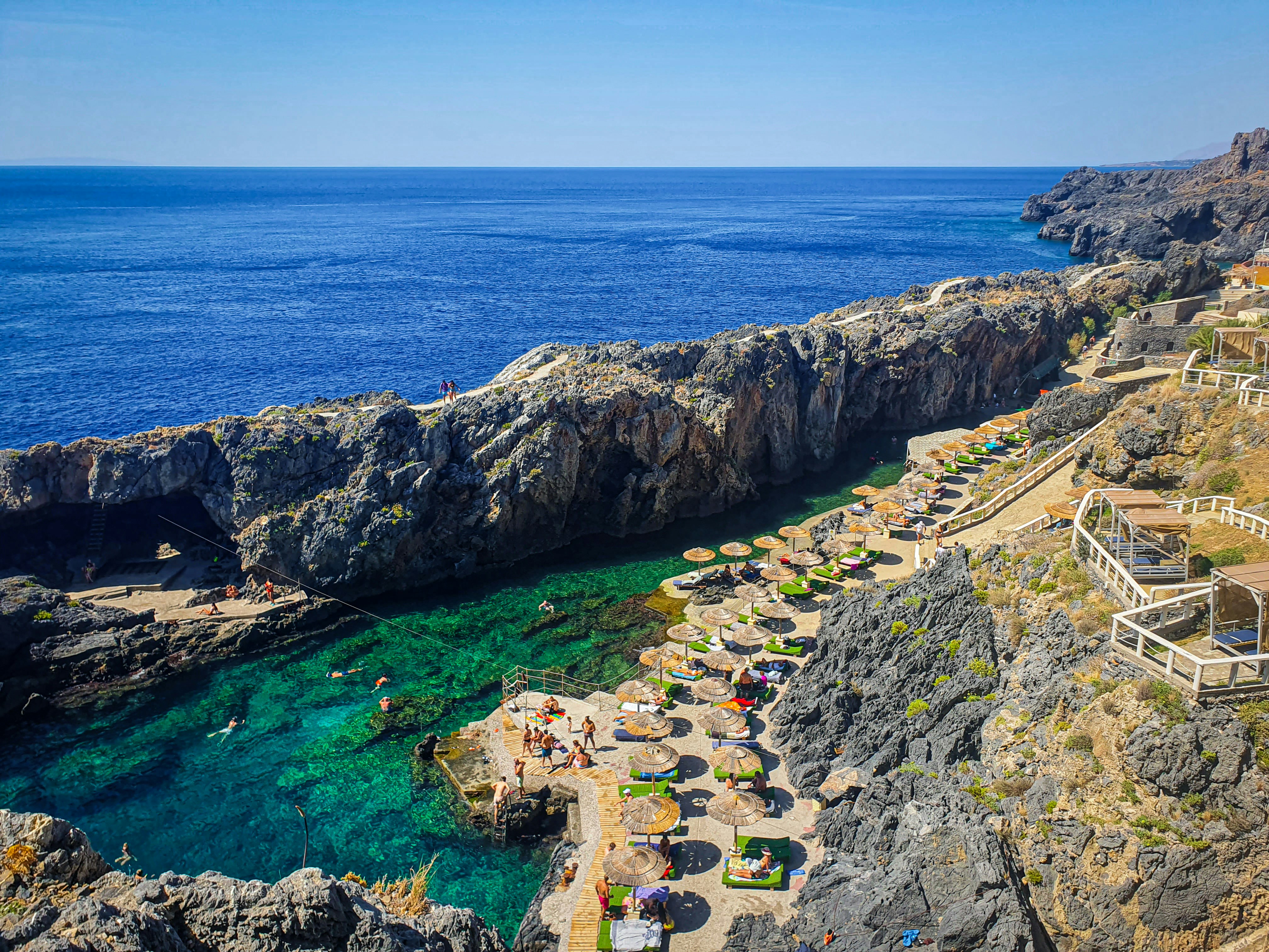 Azure Grotto Overlook: Sunlit Terraces of a Lava-Cliff Pool