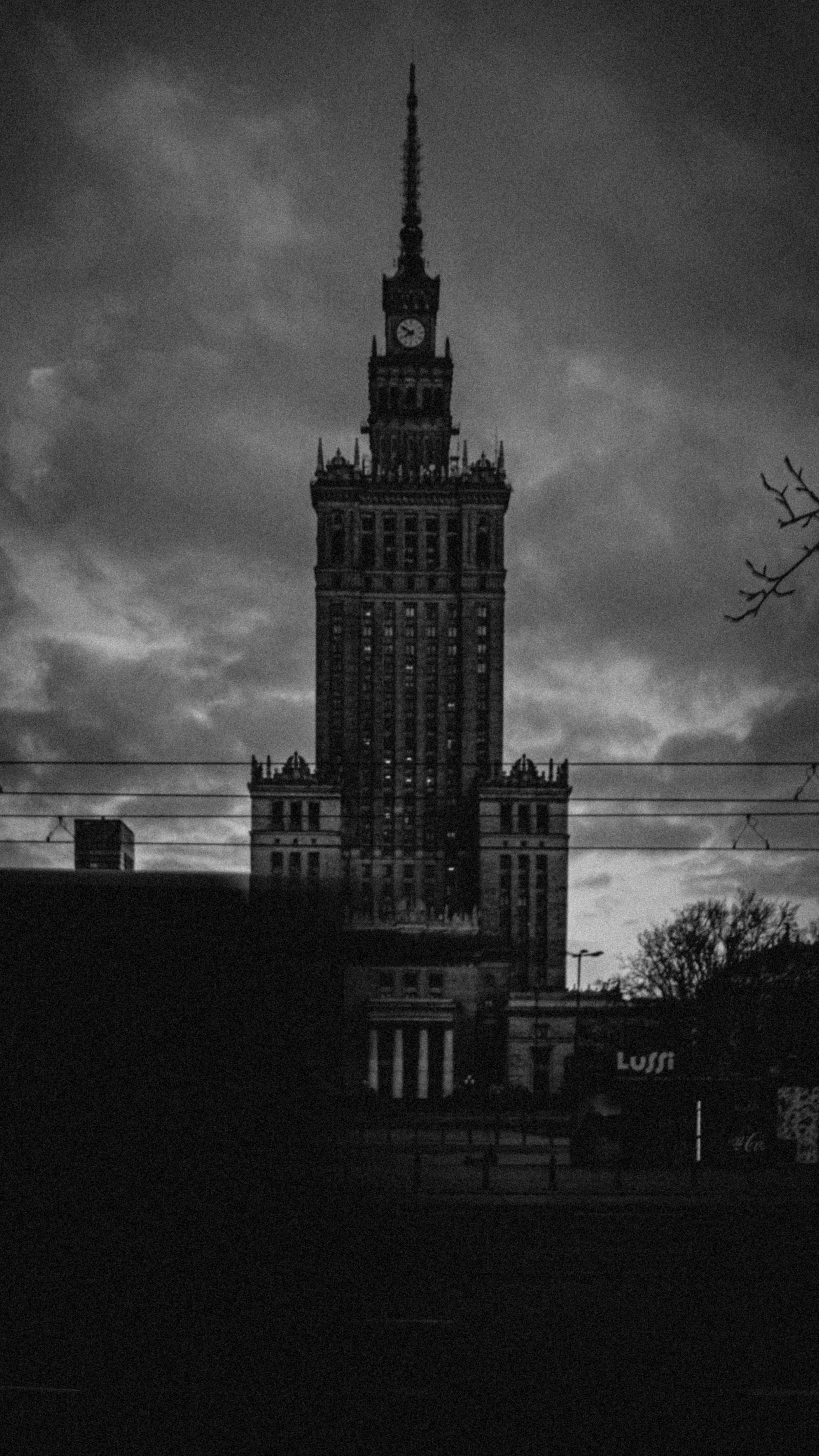 Spire in the Storm: A Gothic Clocktower Dominates the Dim City