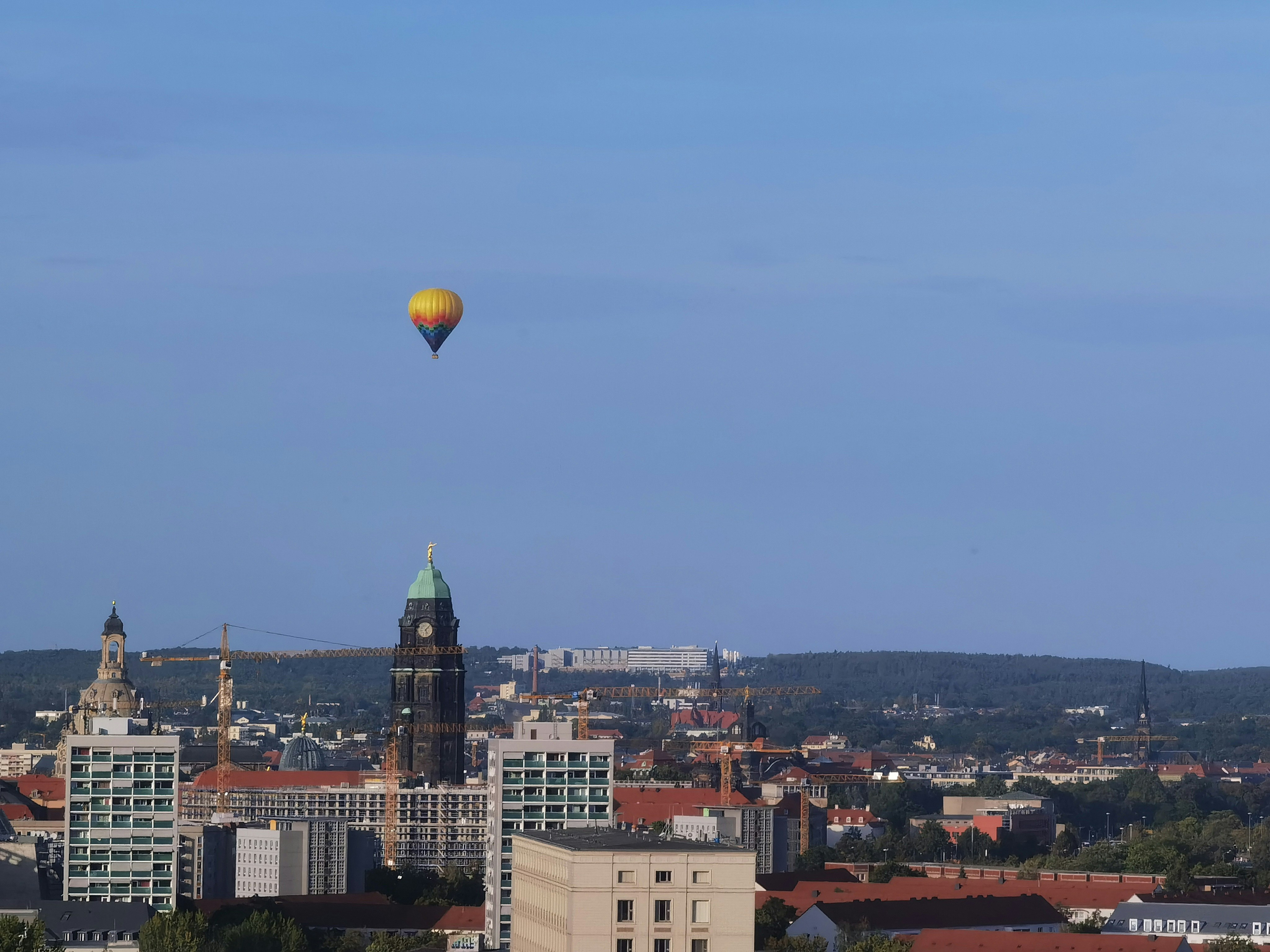 Yellow Balloon Over the City Skyline: A Quiet Skyward Moment
