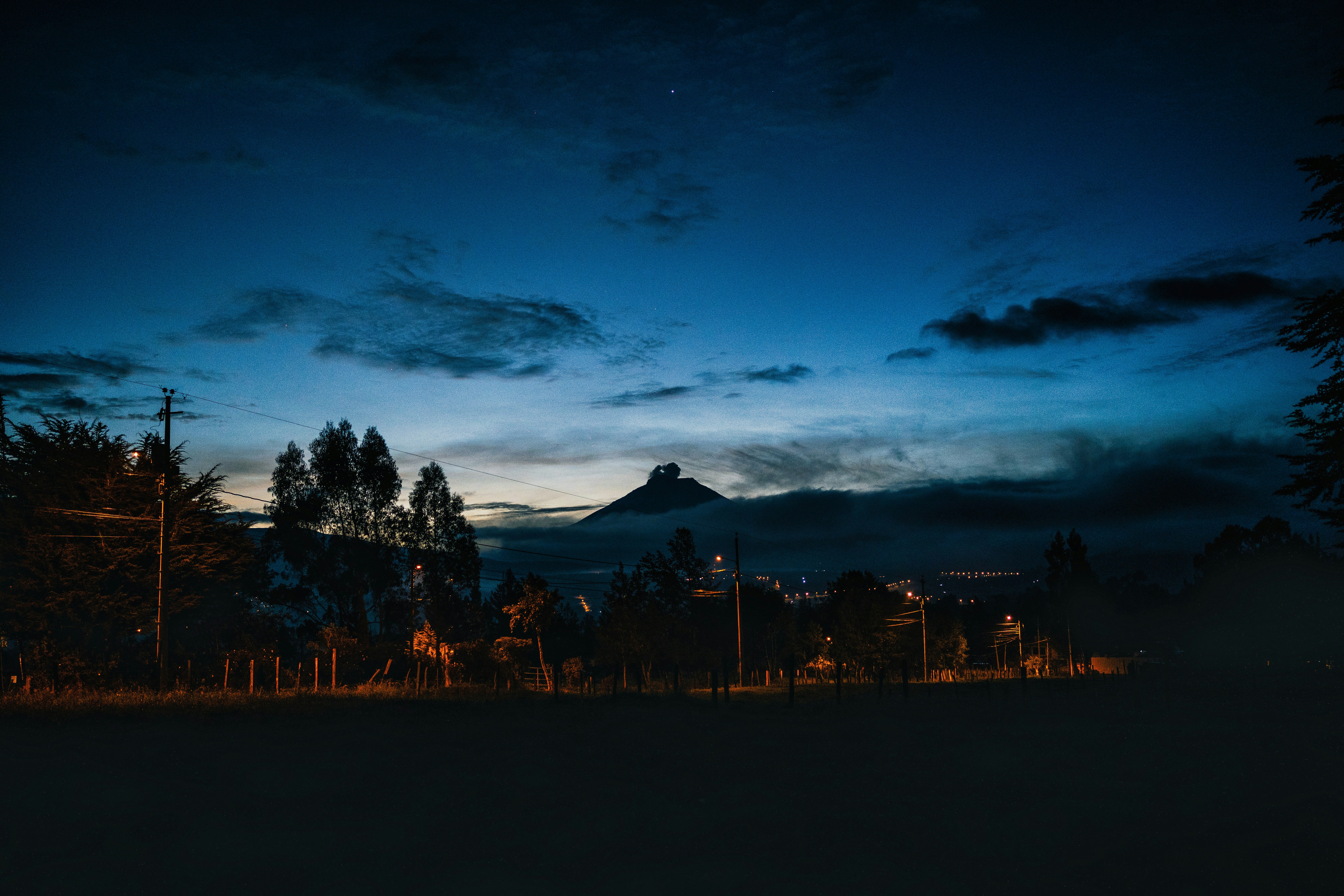 Dusk Ridge Over a Quiet Town Under a Star-Pinned Sky