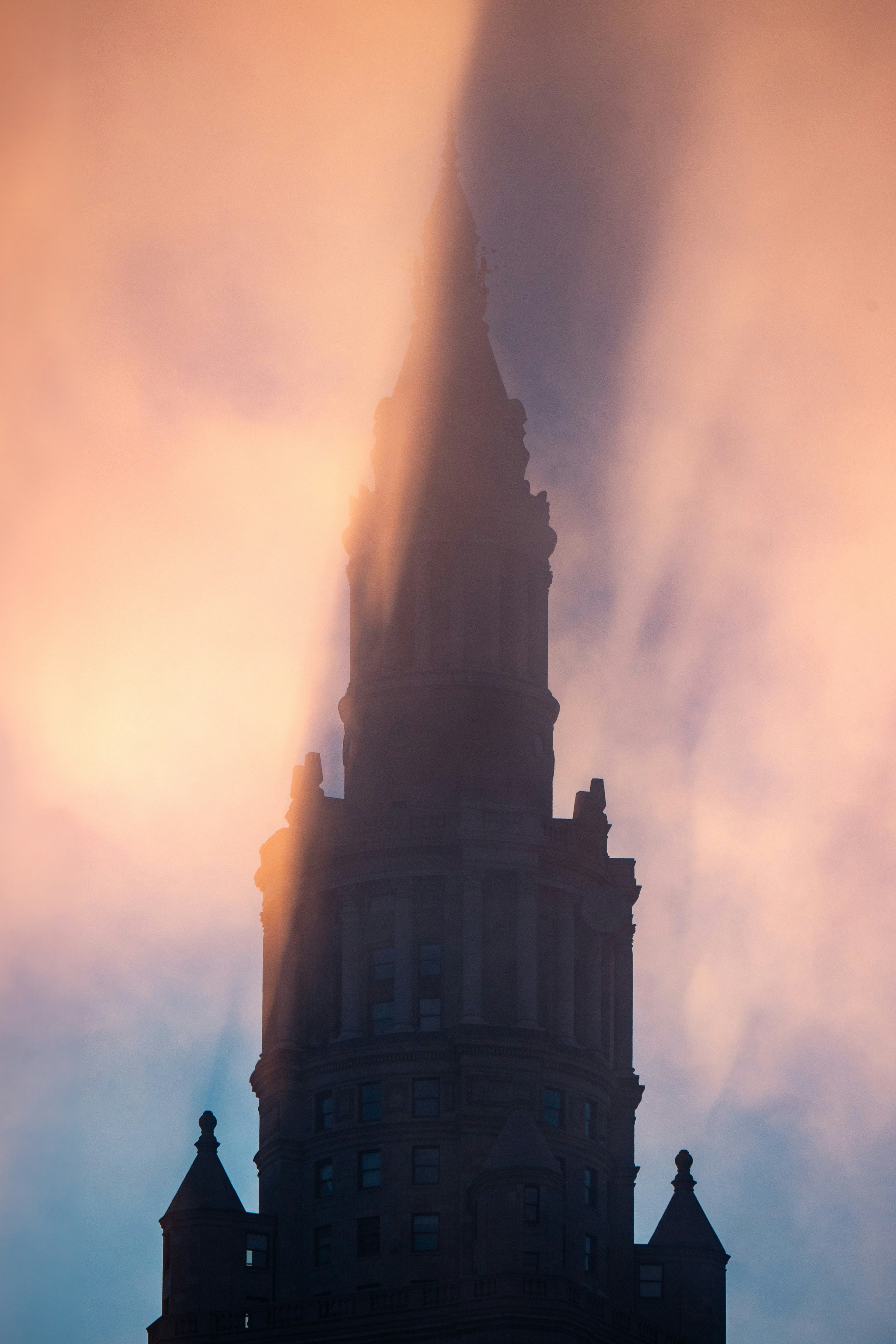 Spire Amid a Dreamlike Veil of Ember Clouds
