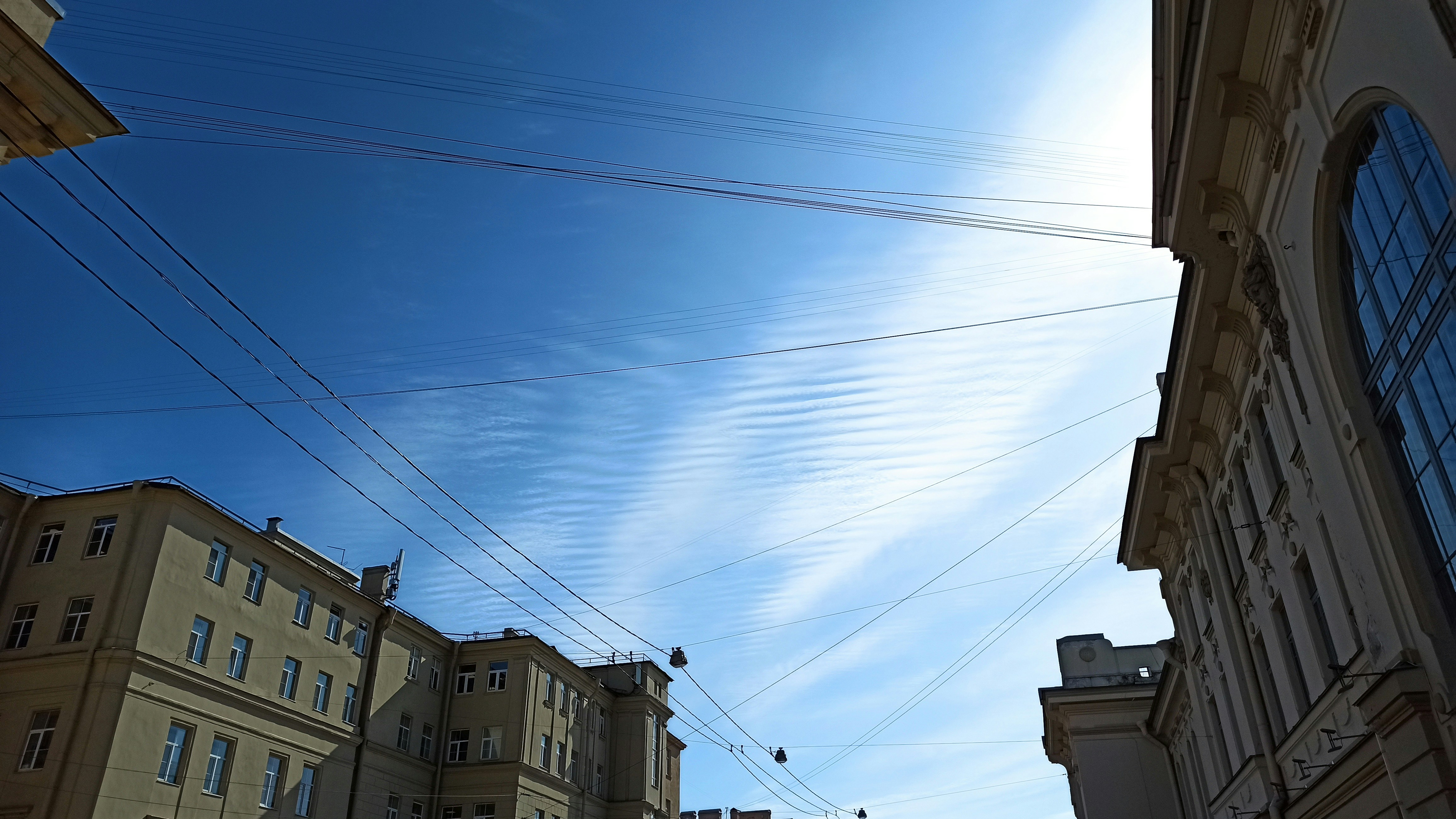 Urban Sky: A Streak of Blue Above Classic Facades