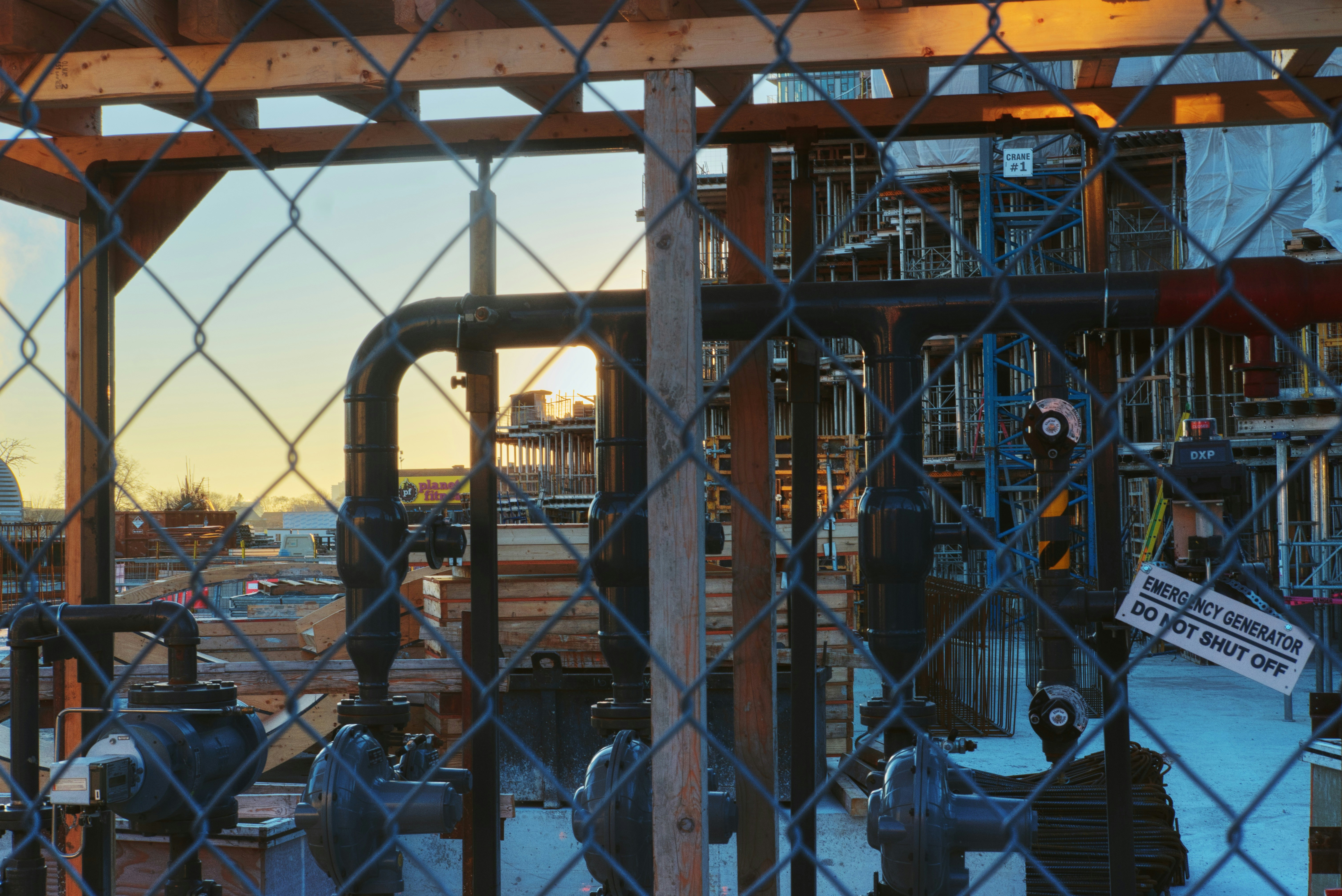 A fire hydrant behind a chain link fence photo – Free Construction ...