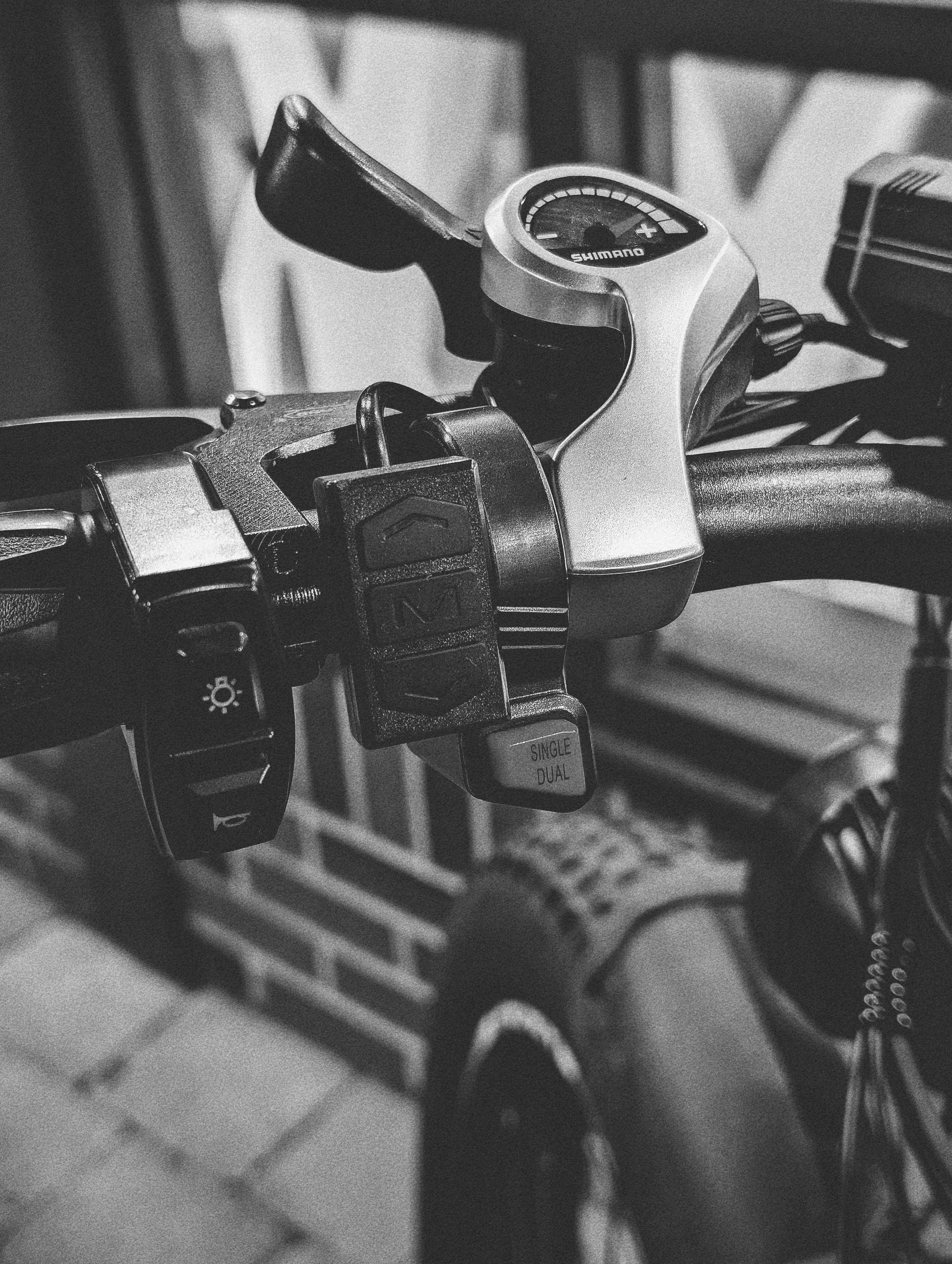 A close up of a bike handlebar with a clock on it photo – Free Grey ...