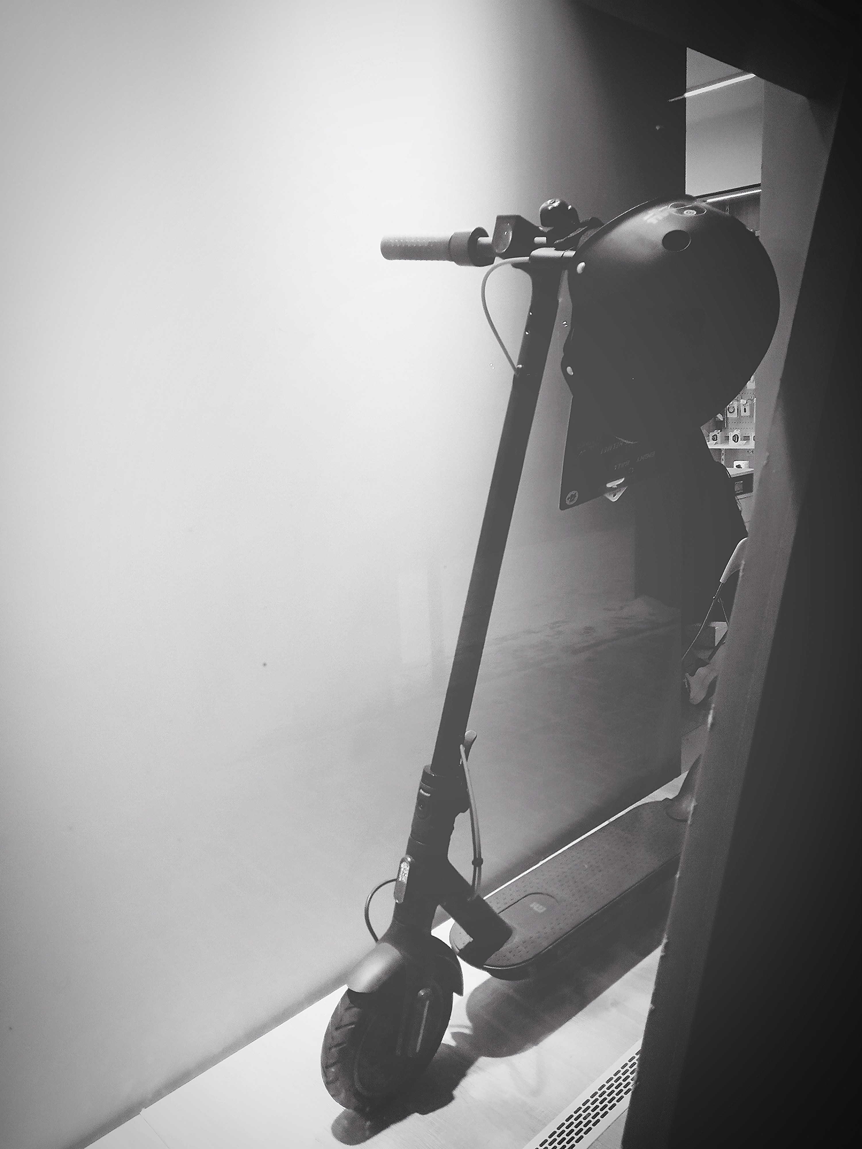 Grayscale Glide: A Minimalist Scooter in Studio Light
