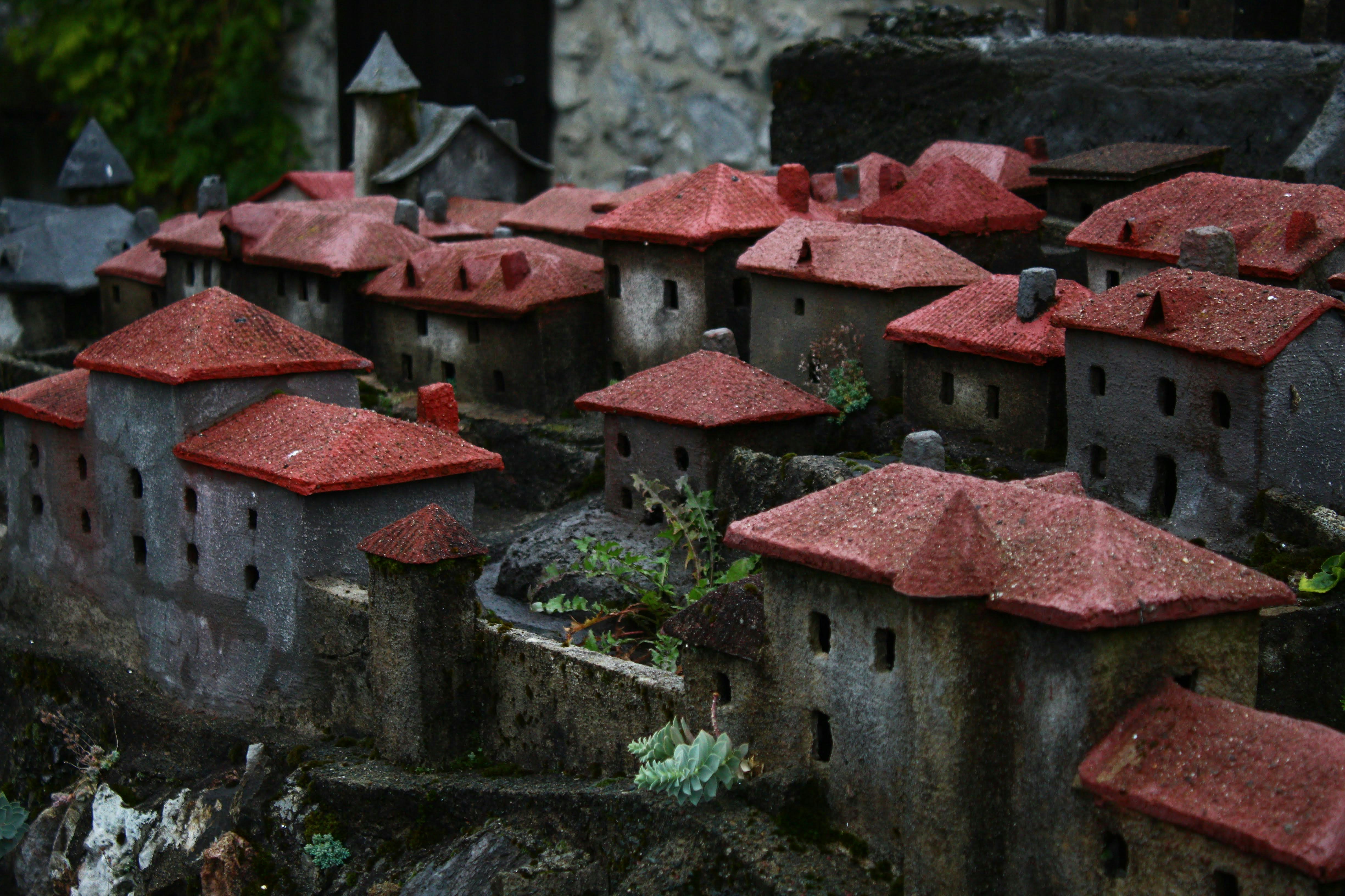A bunch of houses that are sitting on a rock photo – Free Lourdes Image ...