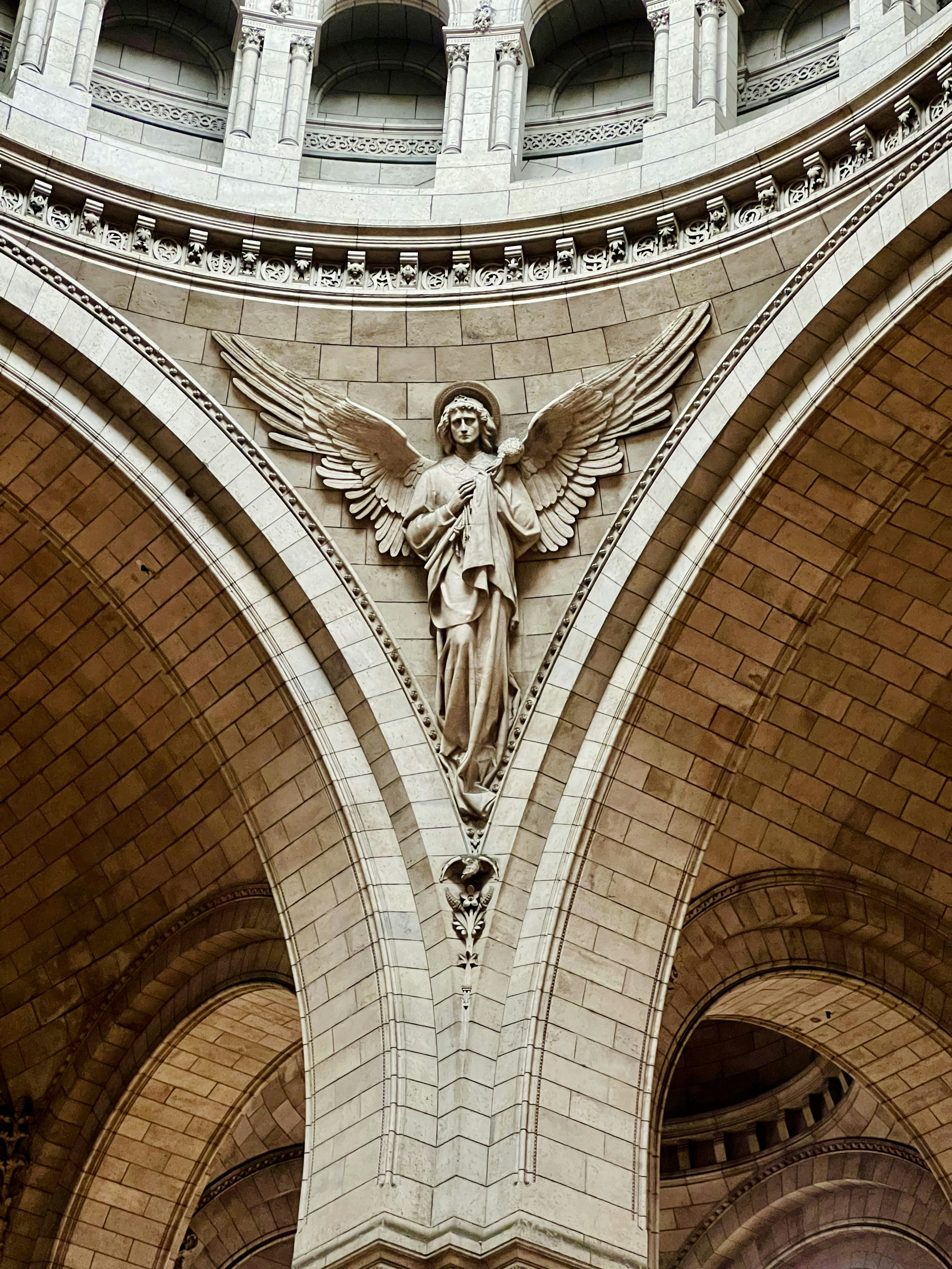 Keystone Angel: Symmetry and Stone in a Grand Archway