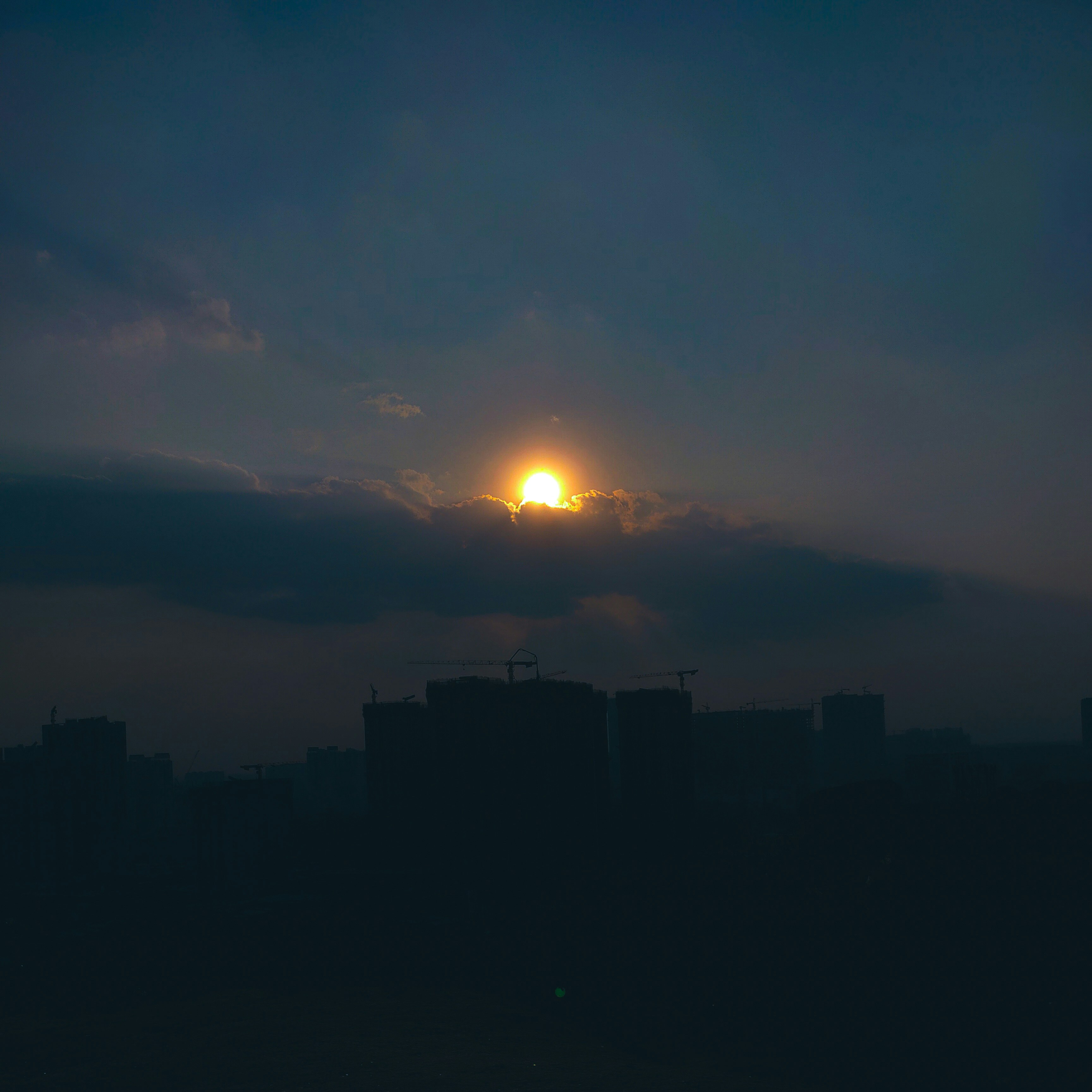 The sun is setting over a city skyline photo – Free Sunset Image on ...