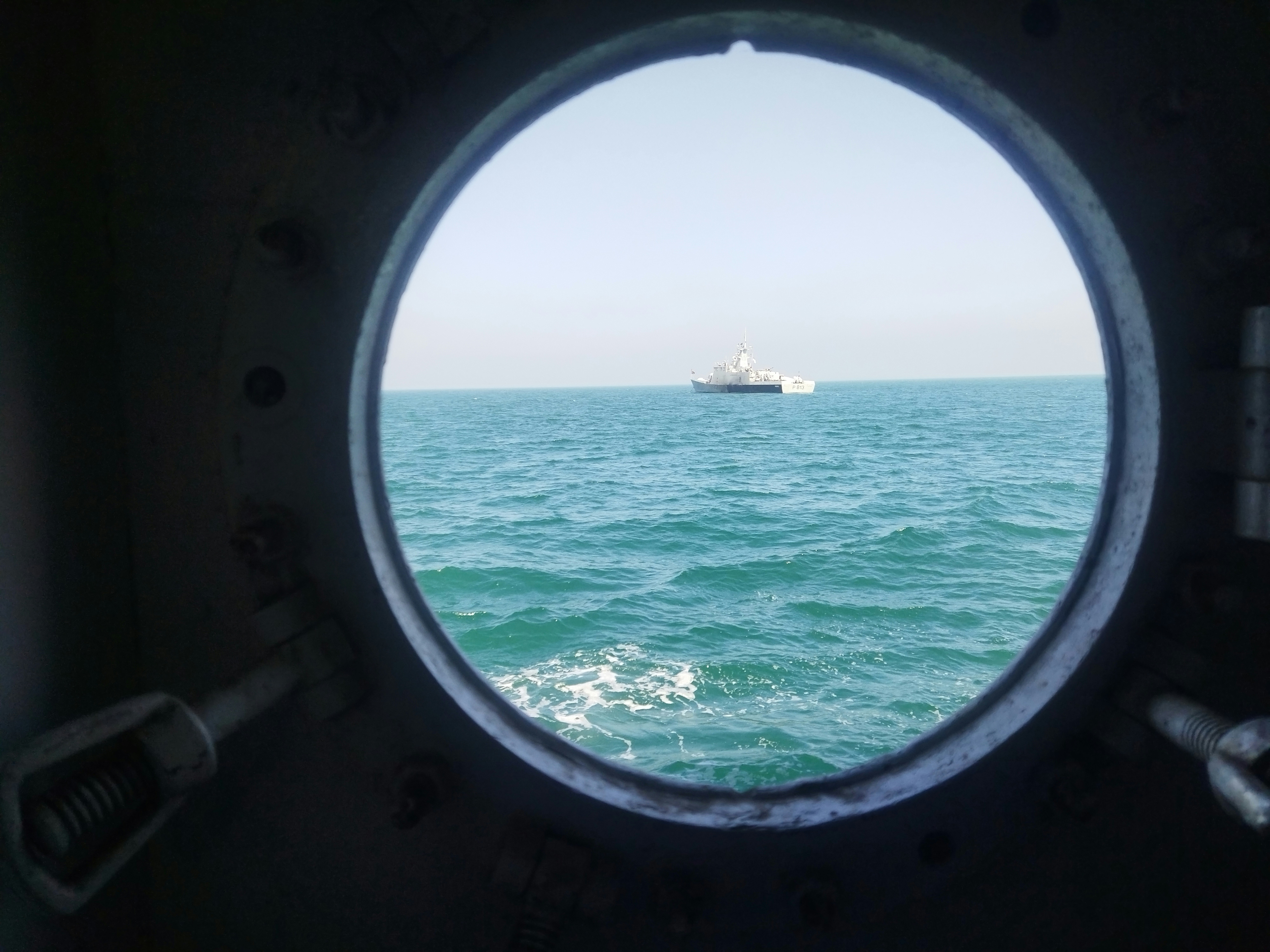 A view of the ocean through a port window photo – Free Blue Image on ...