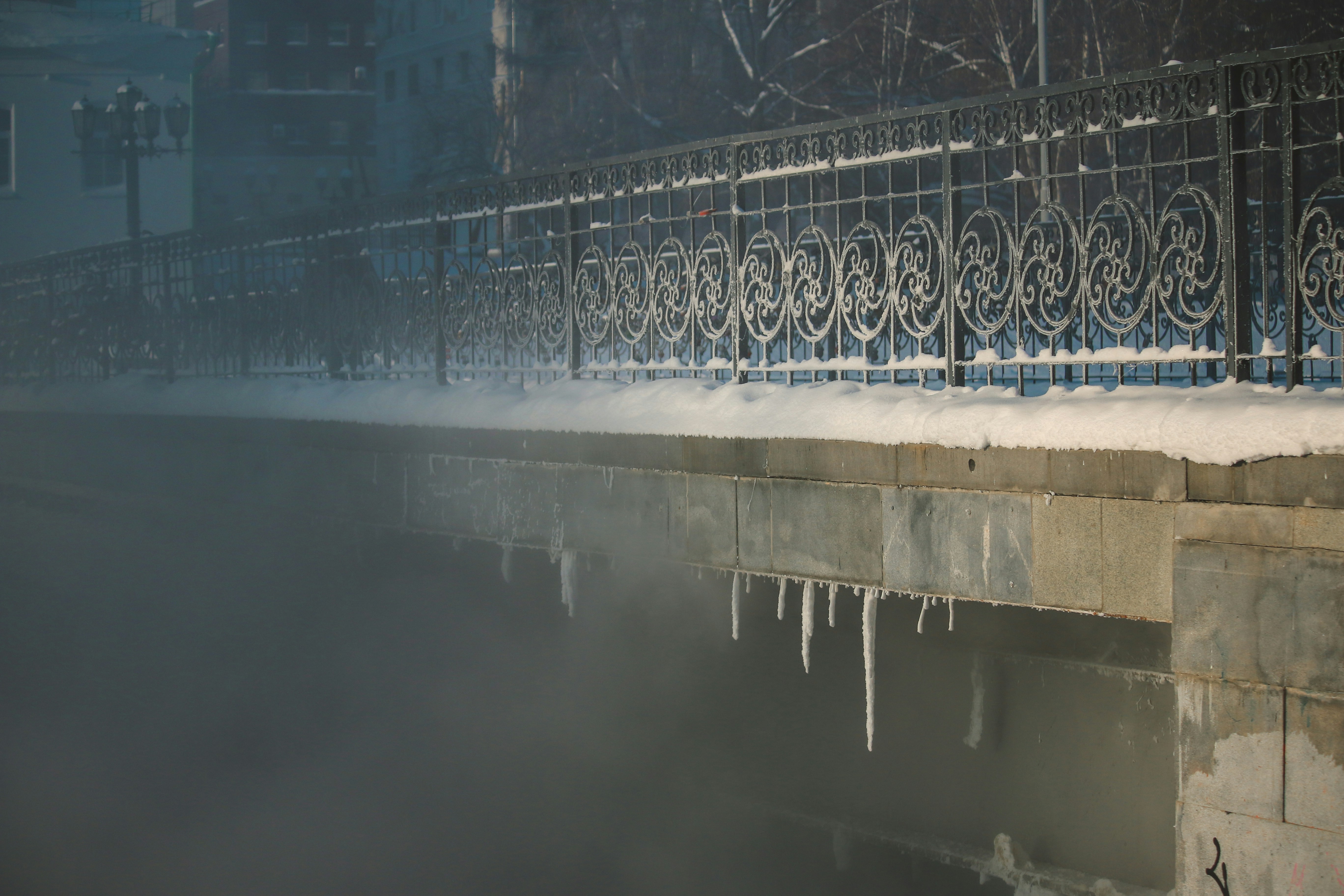 Icicle Lattice Over a Steam-Wrapped Canal