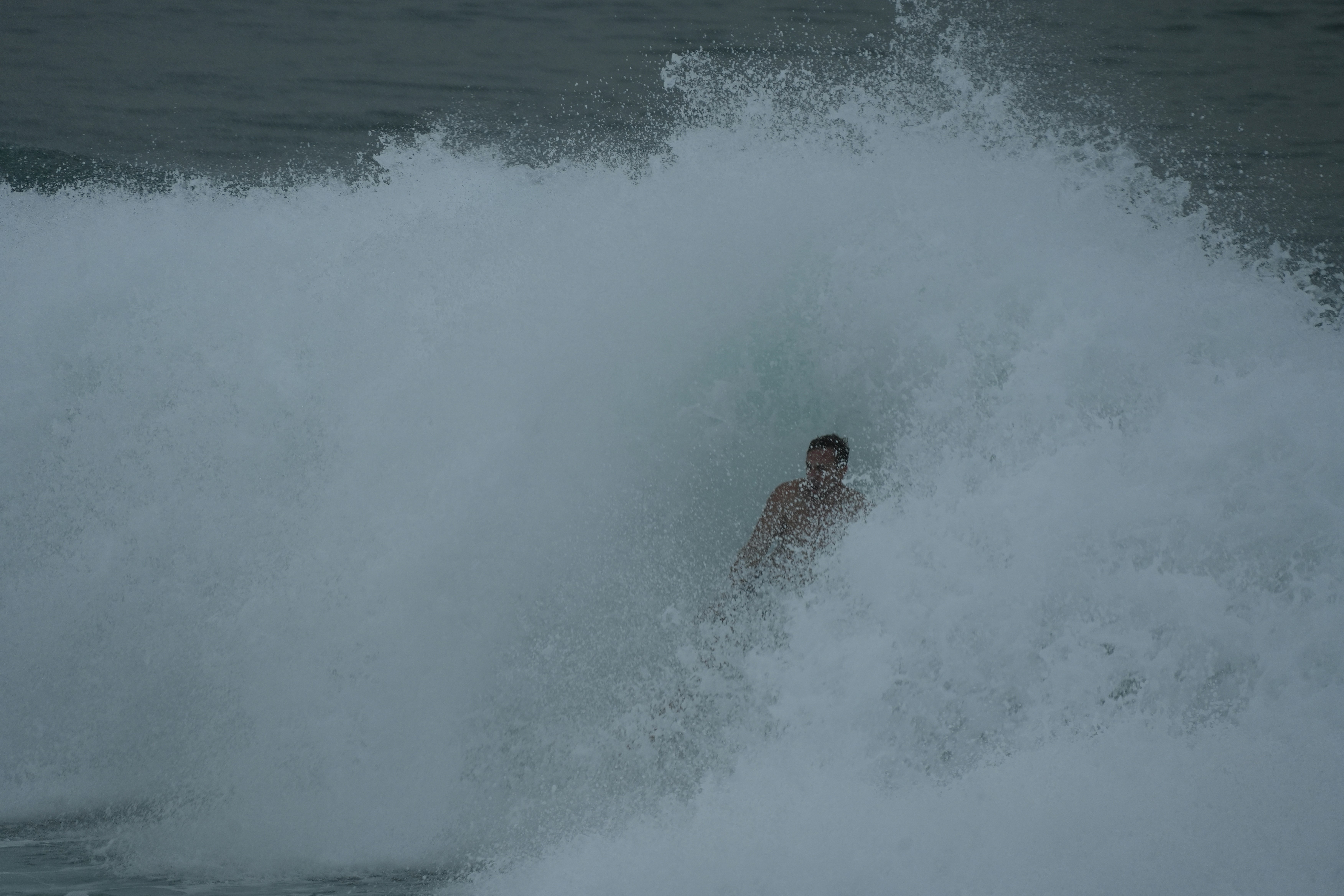 A man riding a wave on top of a surfboard photo – Free Grey Image on ...