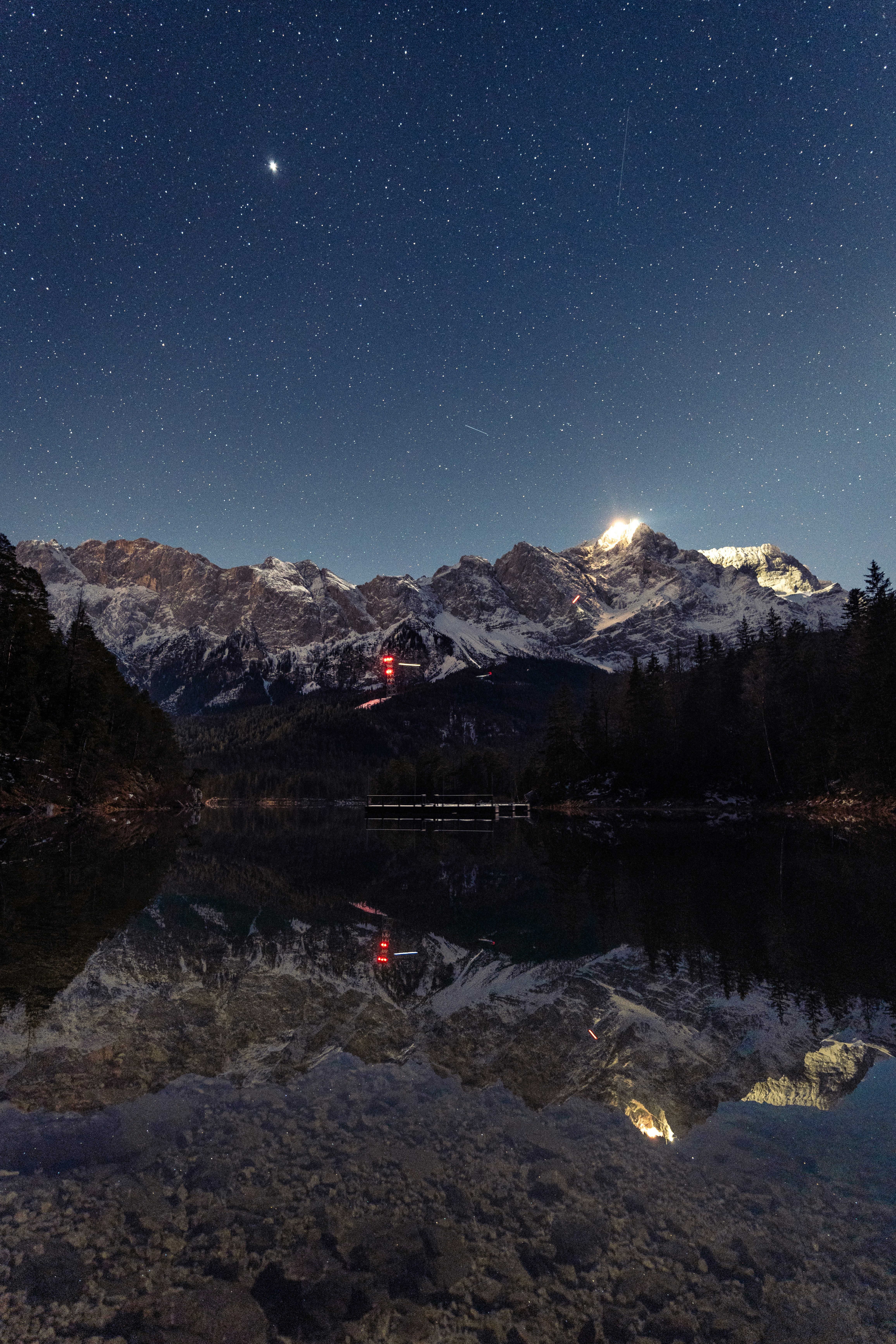 Starfield Over Snowbound Peaks Reflected in a Silent Alpine Lake