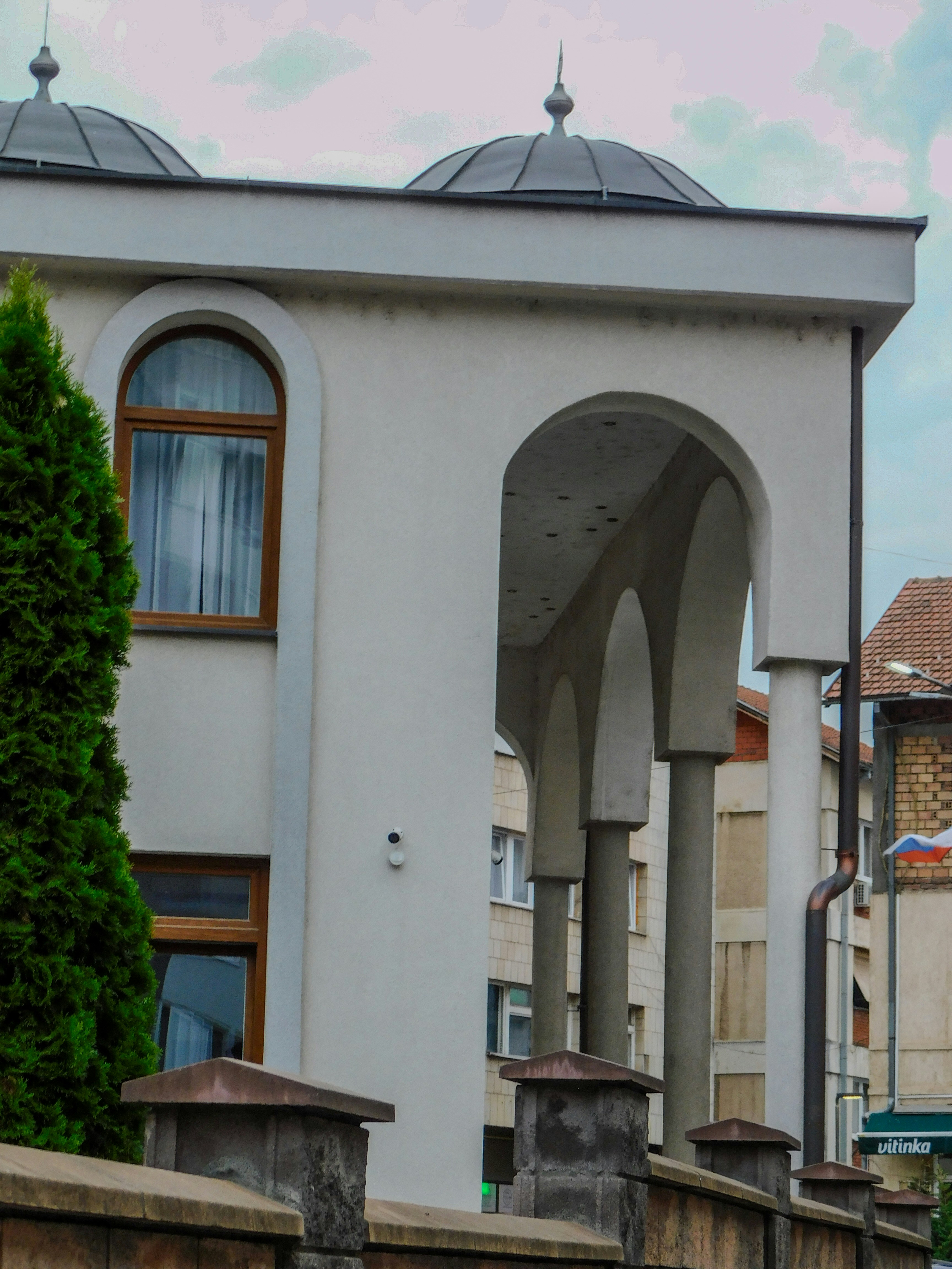 Quiet Arcades: Arches Framed by a Walled Terrace