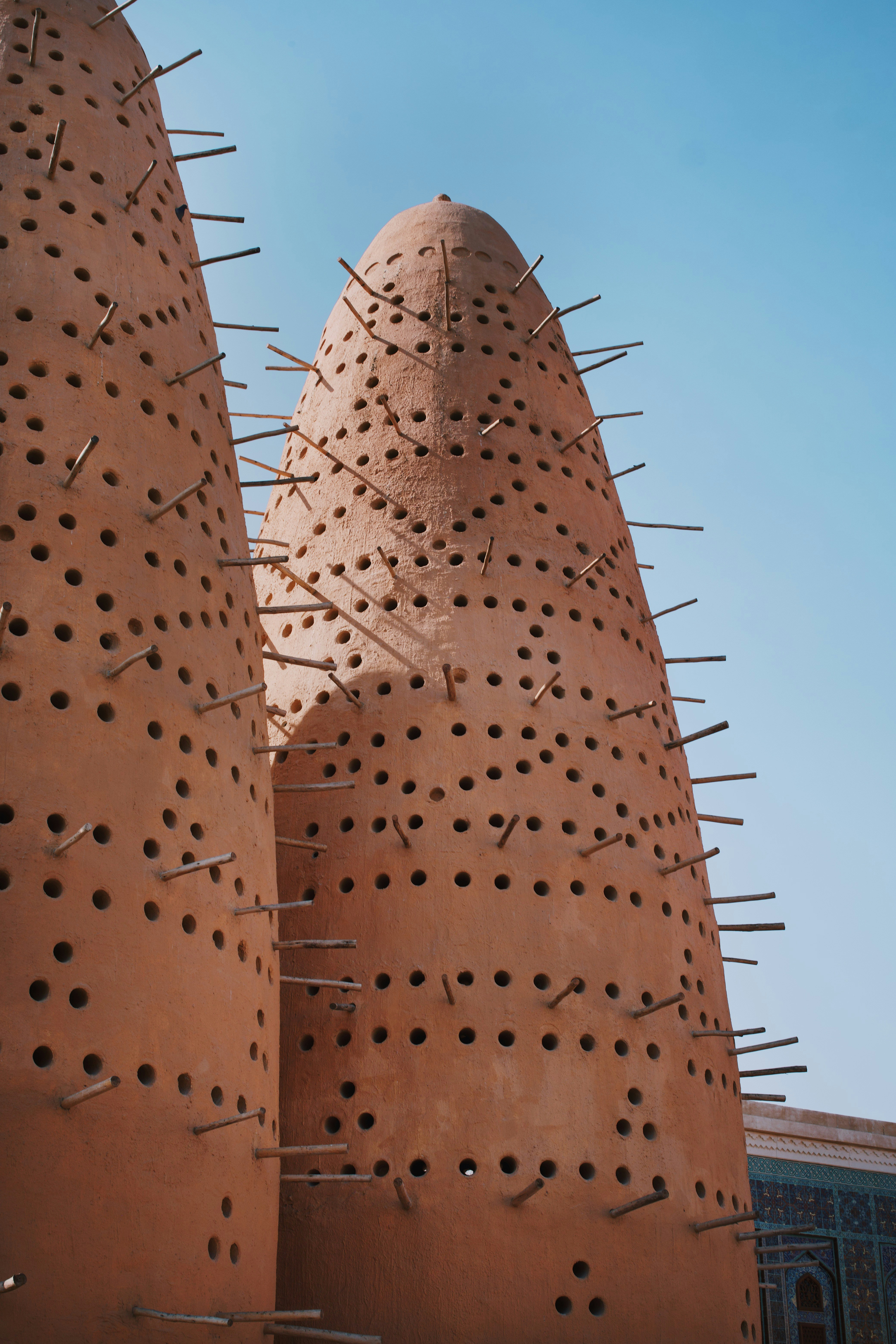 A close up of a building with spikes on it photo – Free Brown Image on ...
