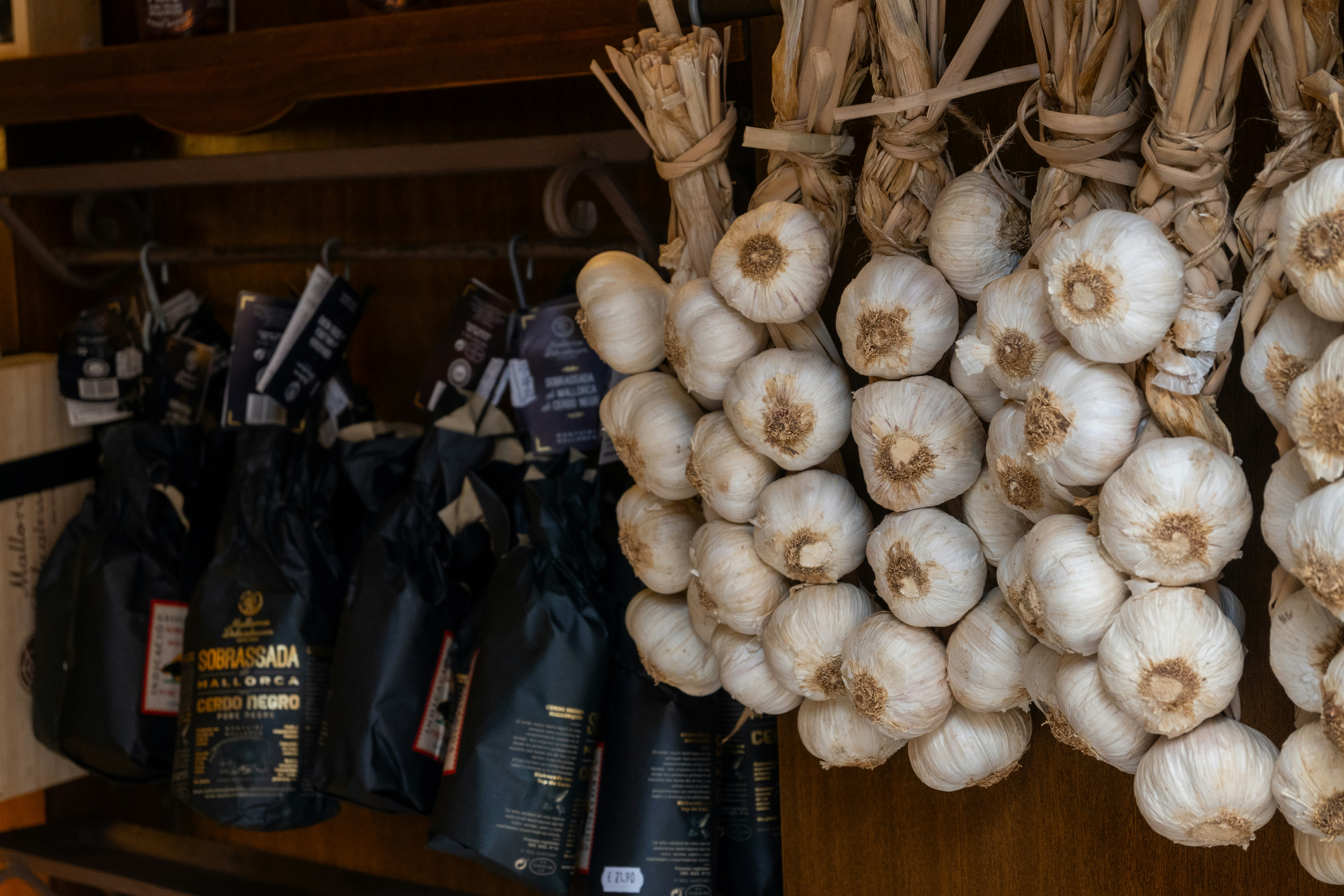 a bunch of garlic hanging on a wall