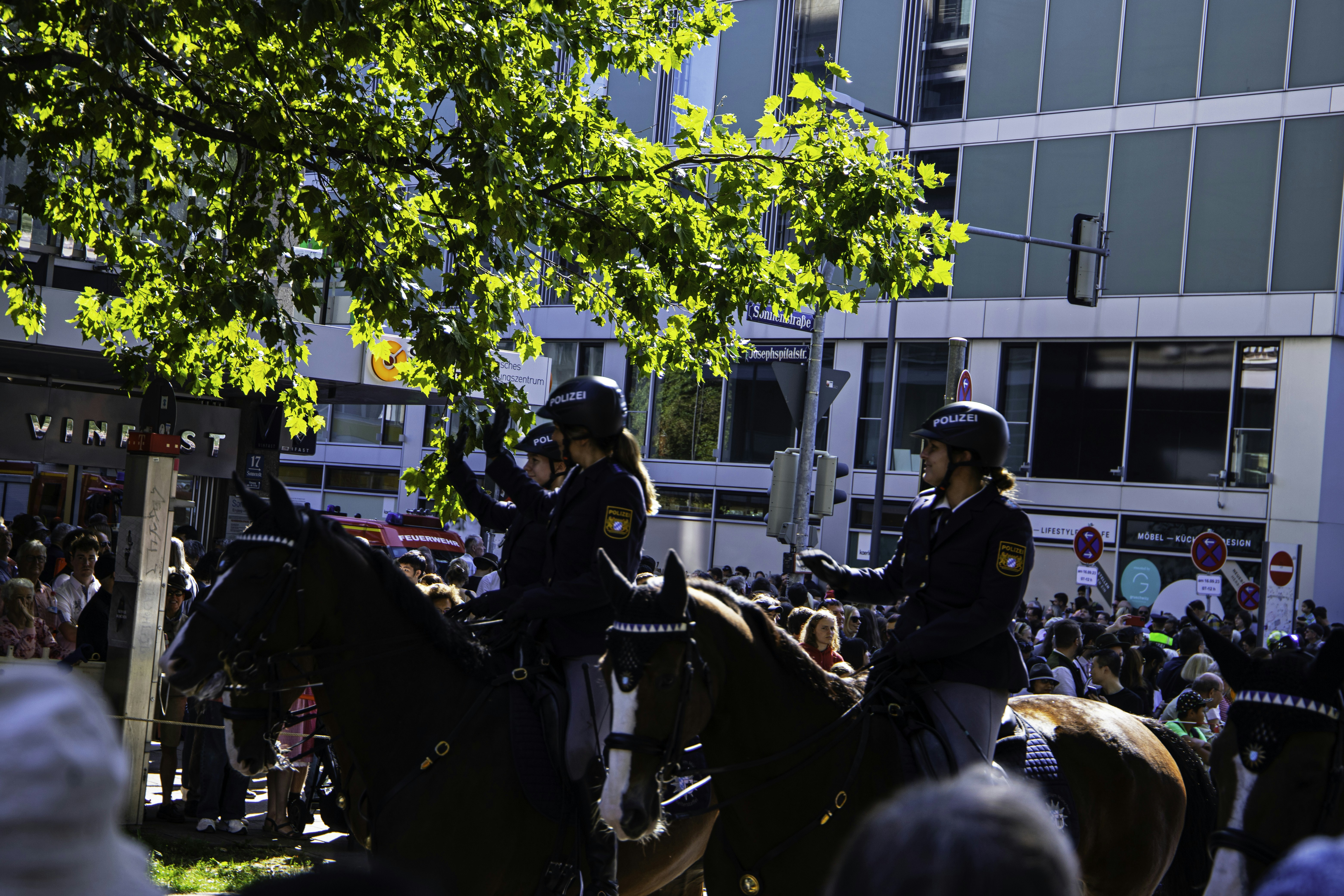 Two police officers riding on the backs of horses photo – Free Munich ...