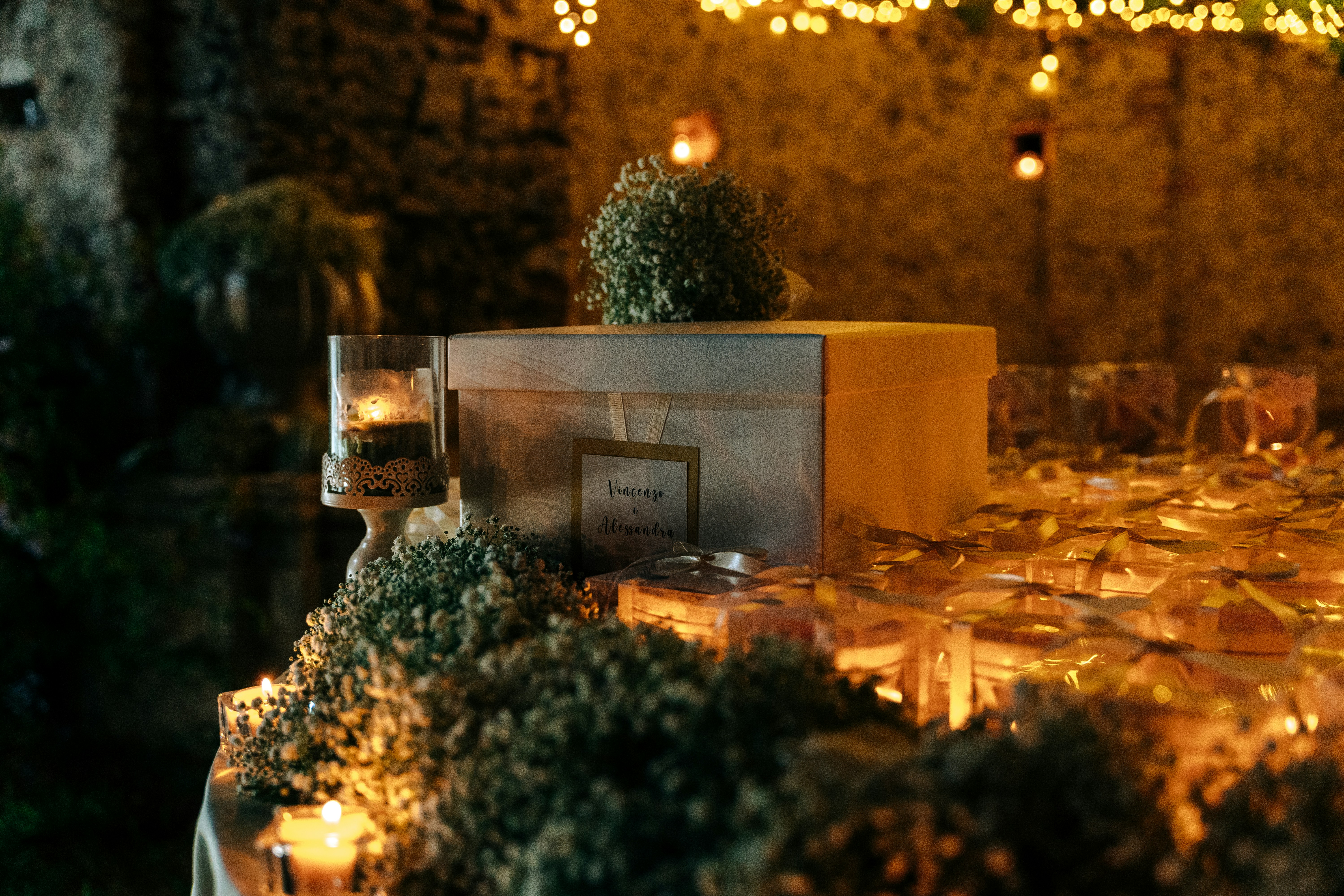 Amber Hour Banquet: candlelit centerpiece under twinkling garden lights