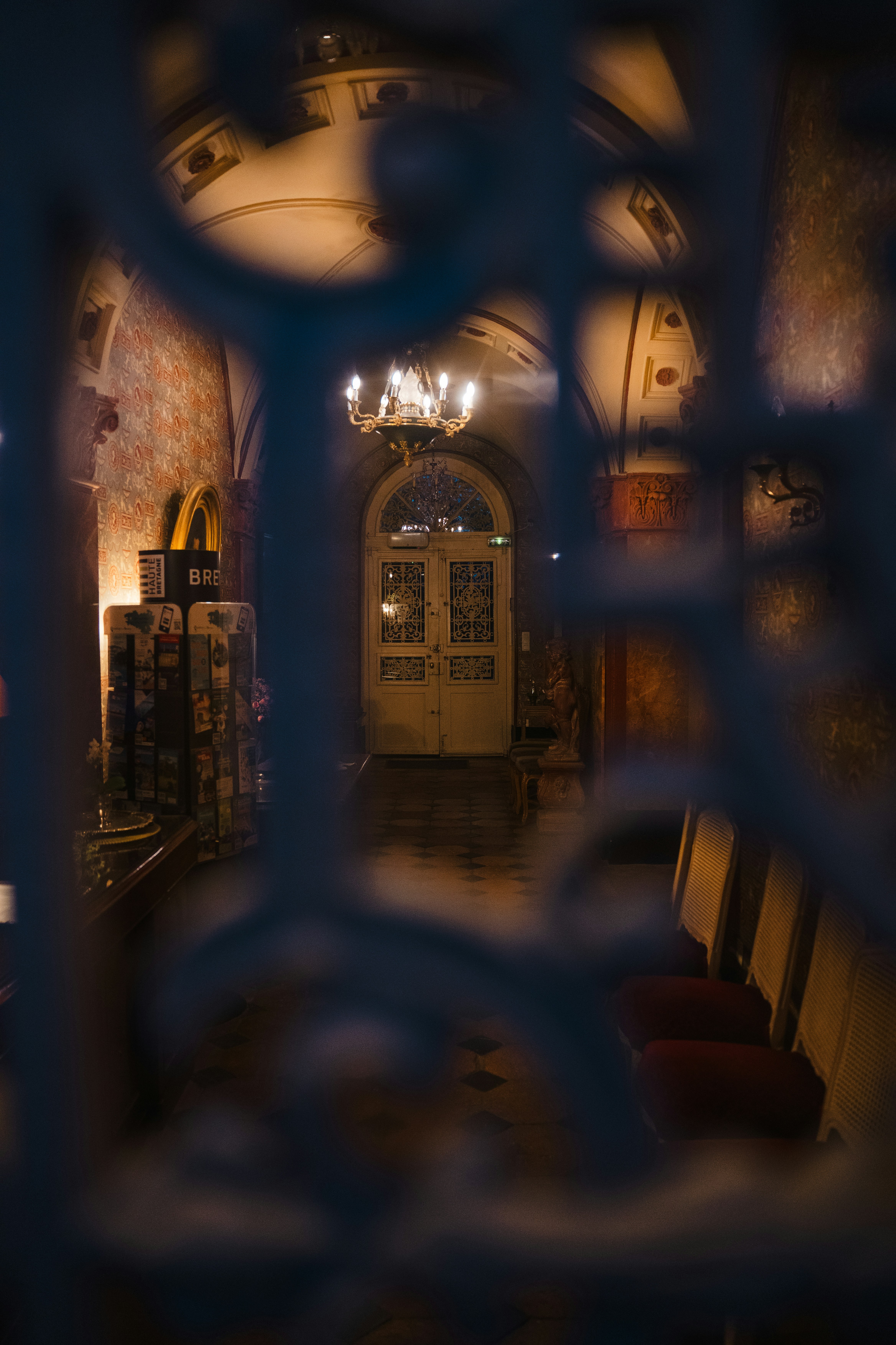 A view of a hallway through a window photo – Free Crypt Image on Unsplash