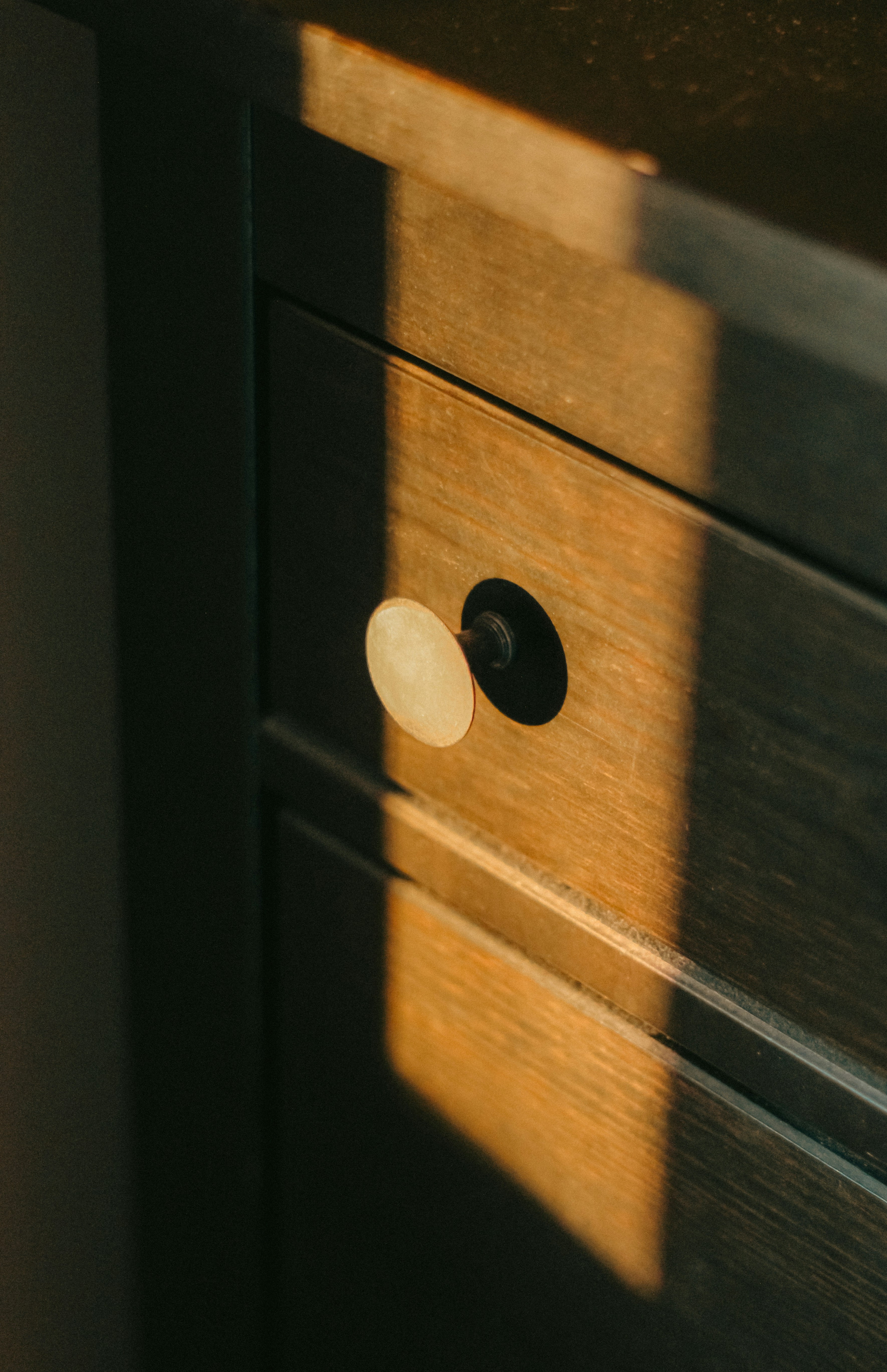 A close up of a drawer with a light shining on it photo – Free ...
