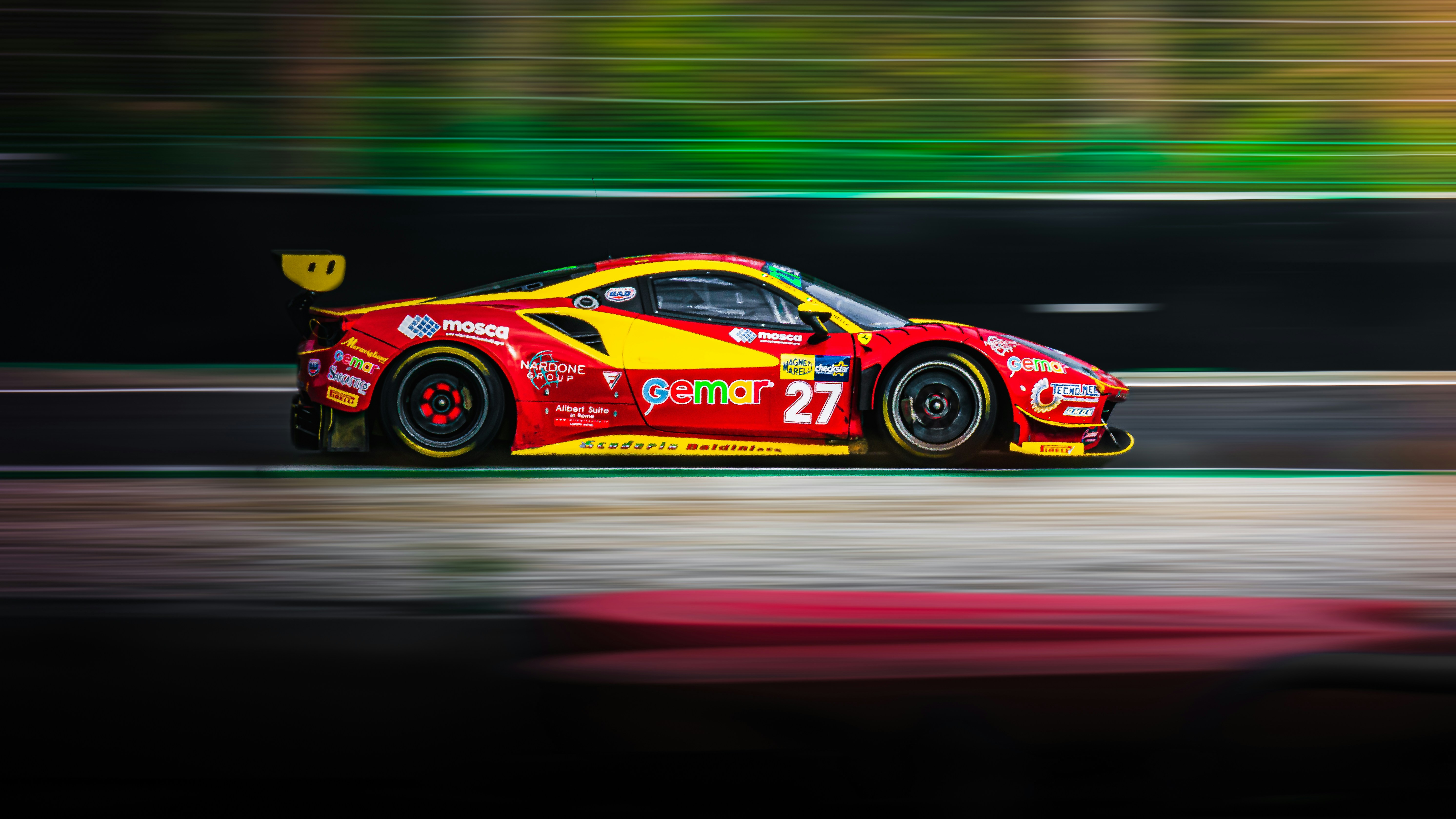 A red and yellow car driving down a race track photo – Free Monza Image ...