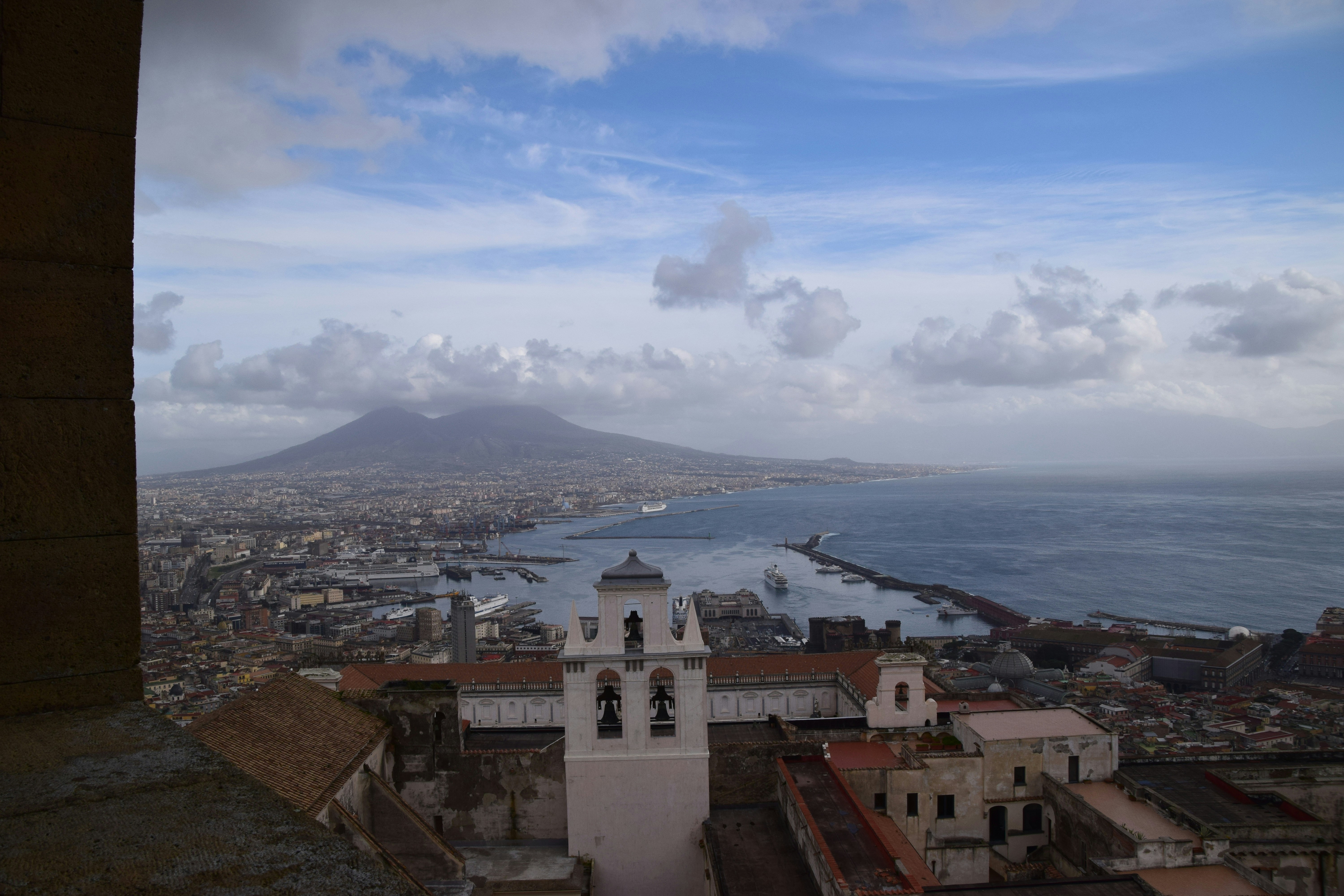 Vantage Overlook of Coastal Cityscape and Majestic Mountain