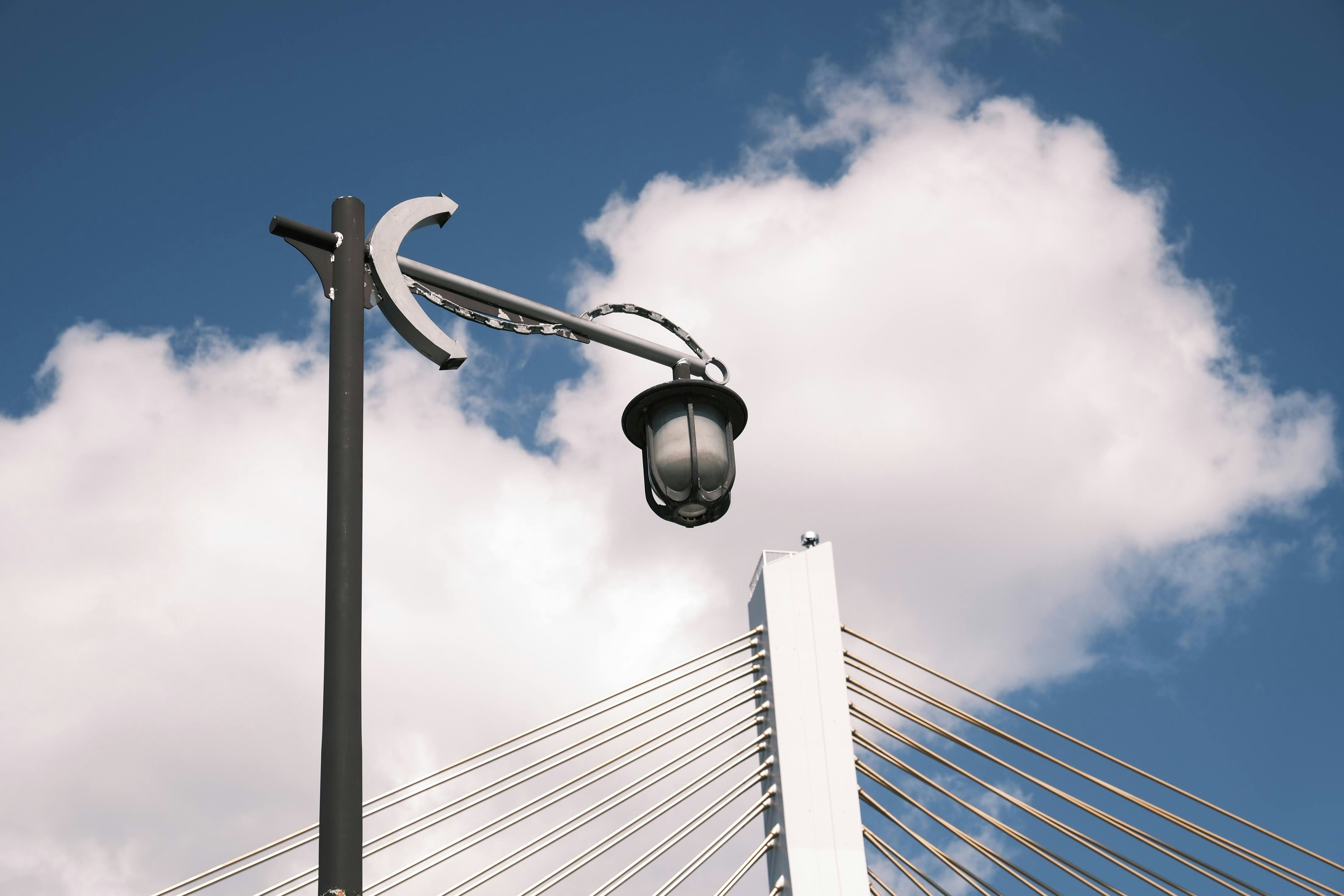 Lantern in the Sky: A Quiet Moment Beneath the Cable-Stayed Spine