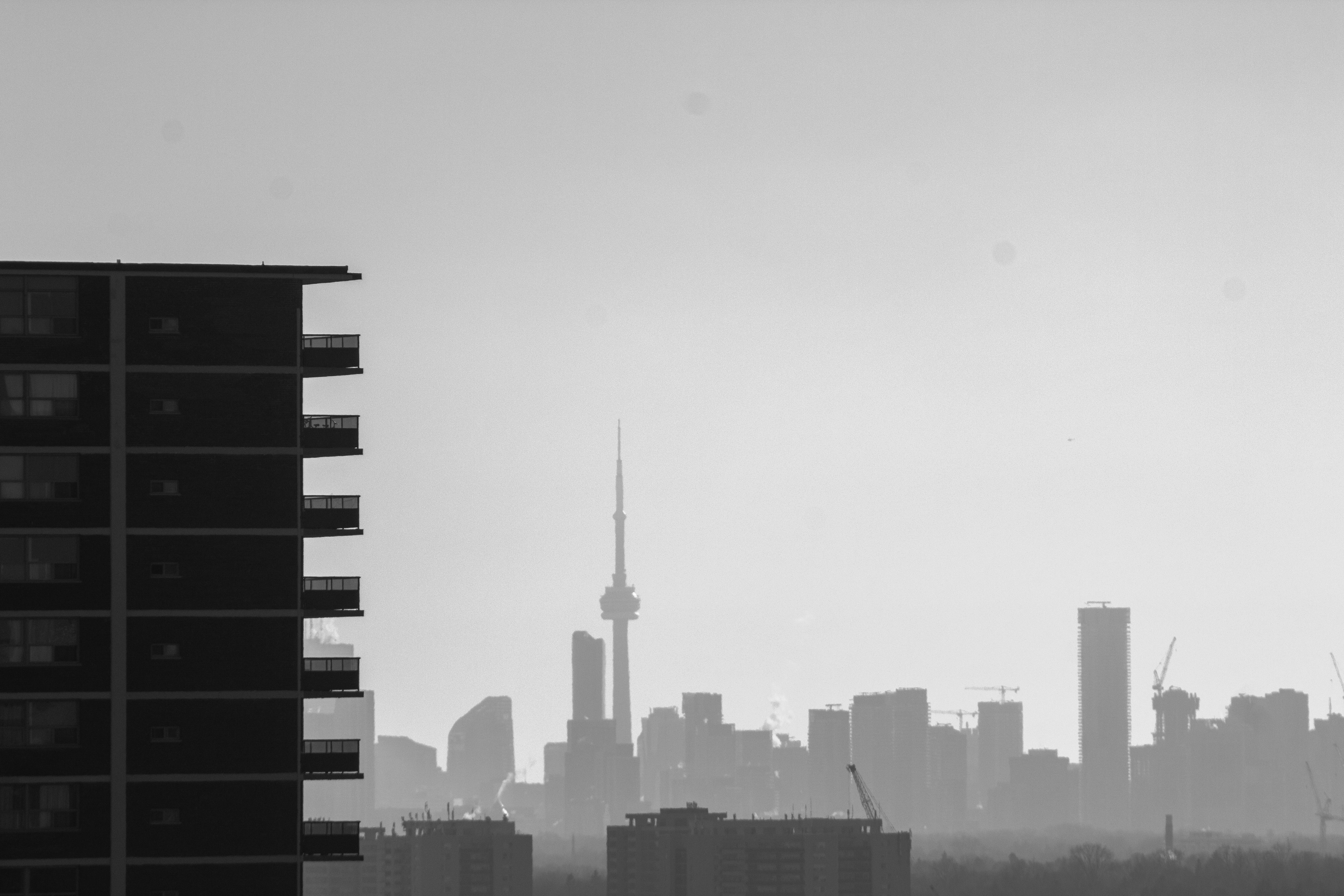 Distant Spire in Quiet Haze: A Monochrome Cityscape