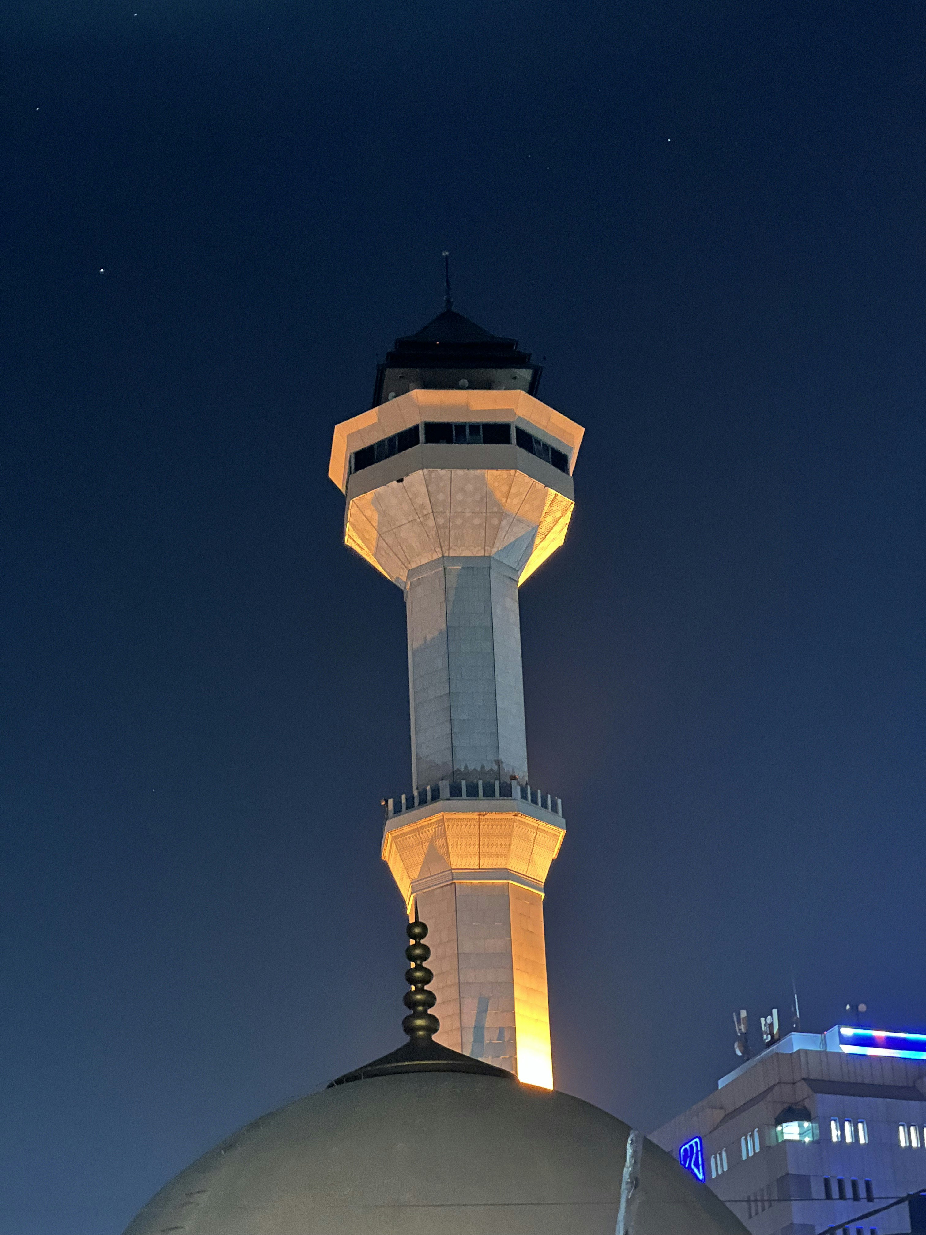 Midnight Beacon: The Angular Tower Woven in Amber Light