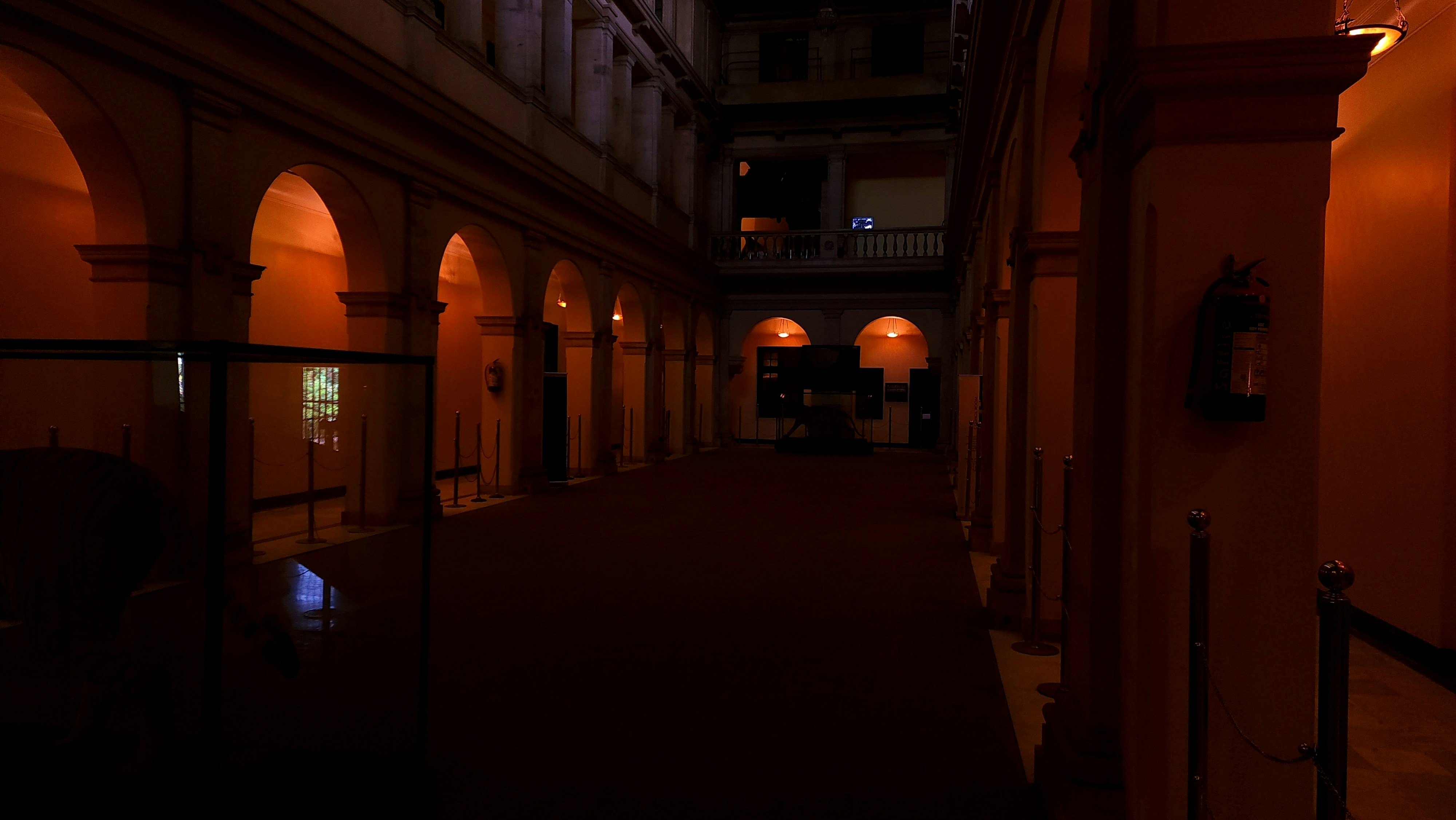 Dim Corridor of Lantern-lit Arches