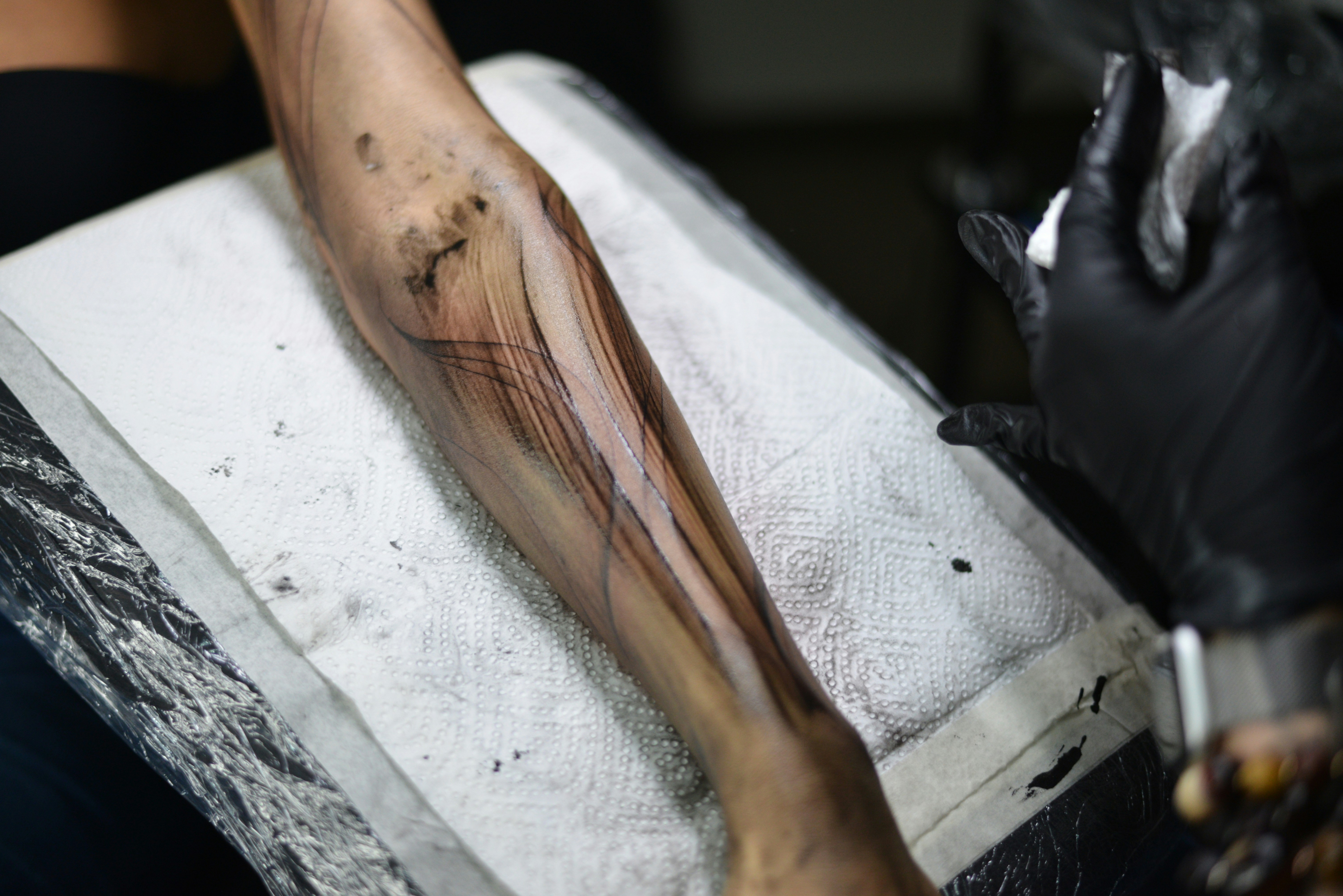 A person is getting a tattoo on their arm photo – Free Girl Image on ...
