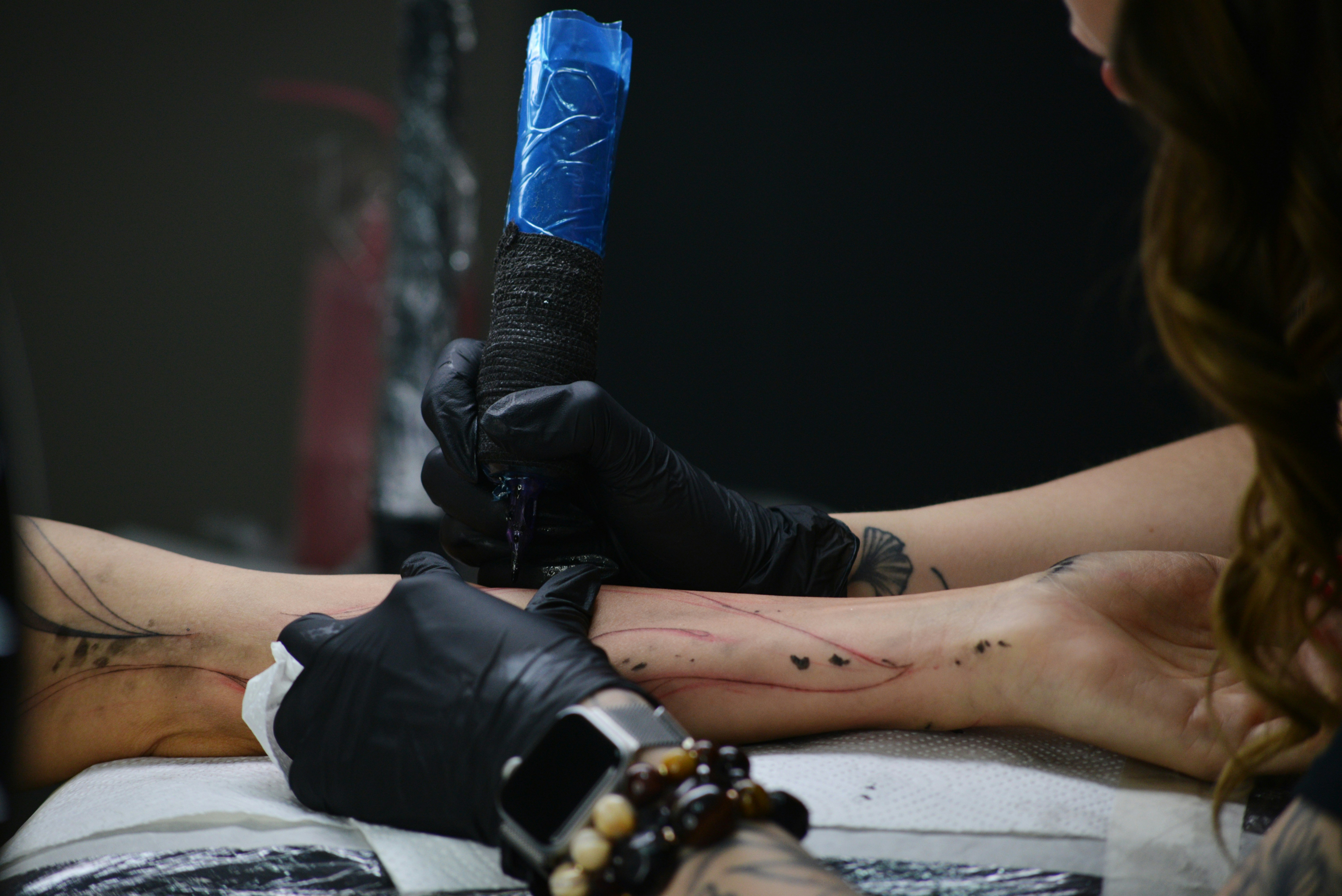 Blue-Tipped Precision: Tracing Fine Lines on a Forearm