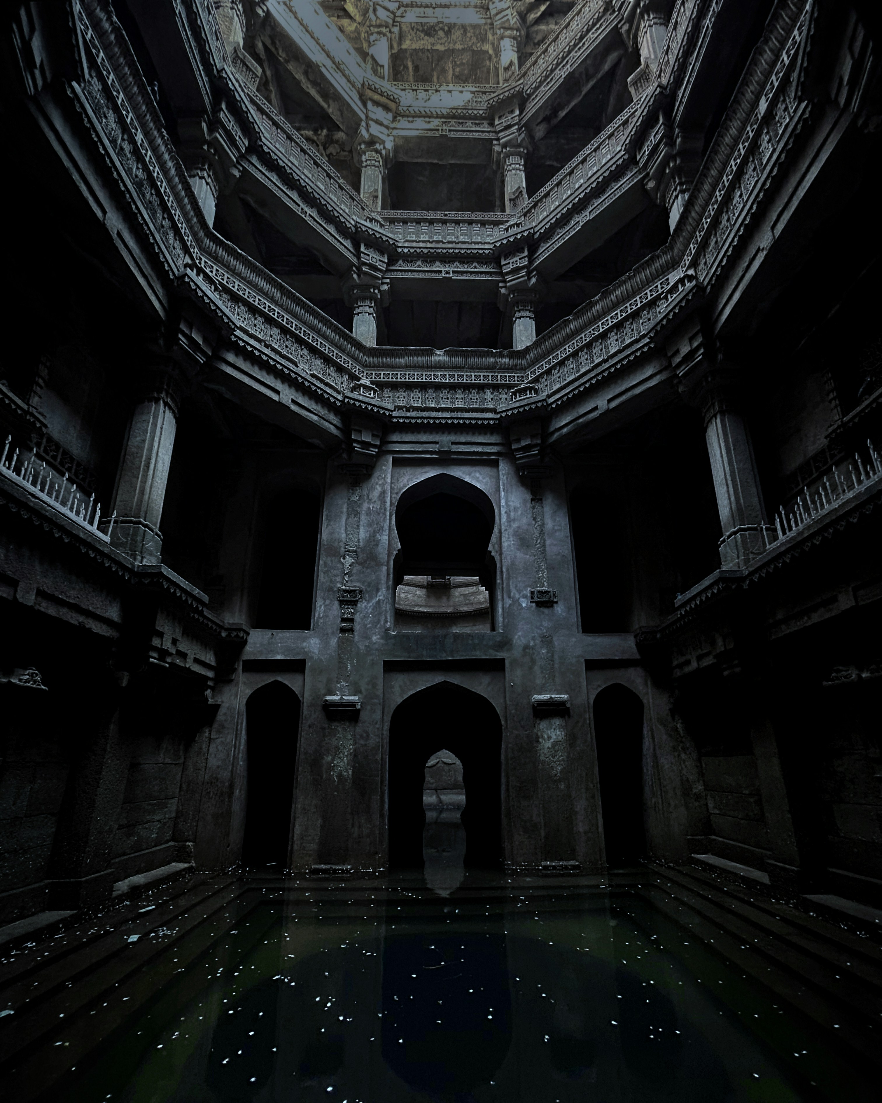 Midnight Atrium: Concentric Arches Embrace a Silent Pool