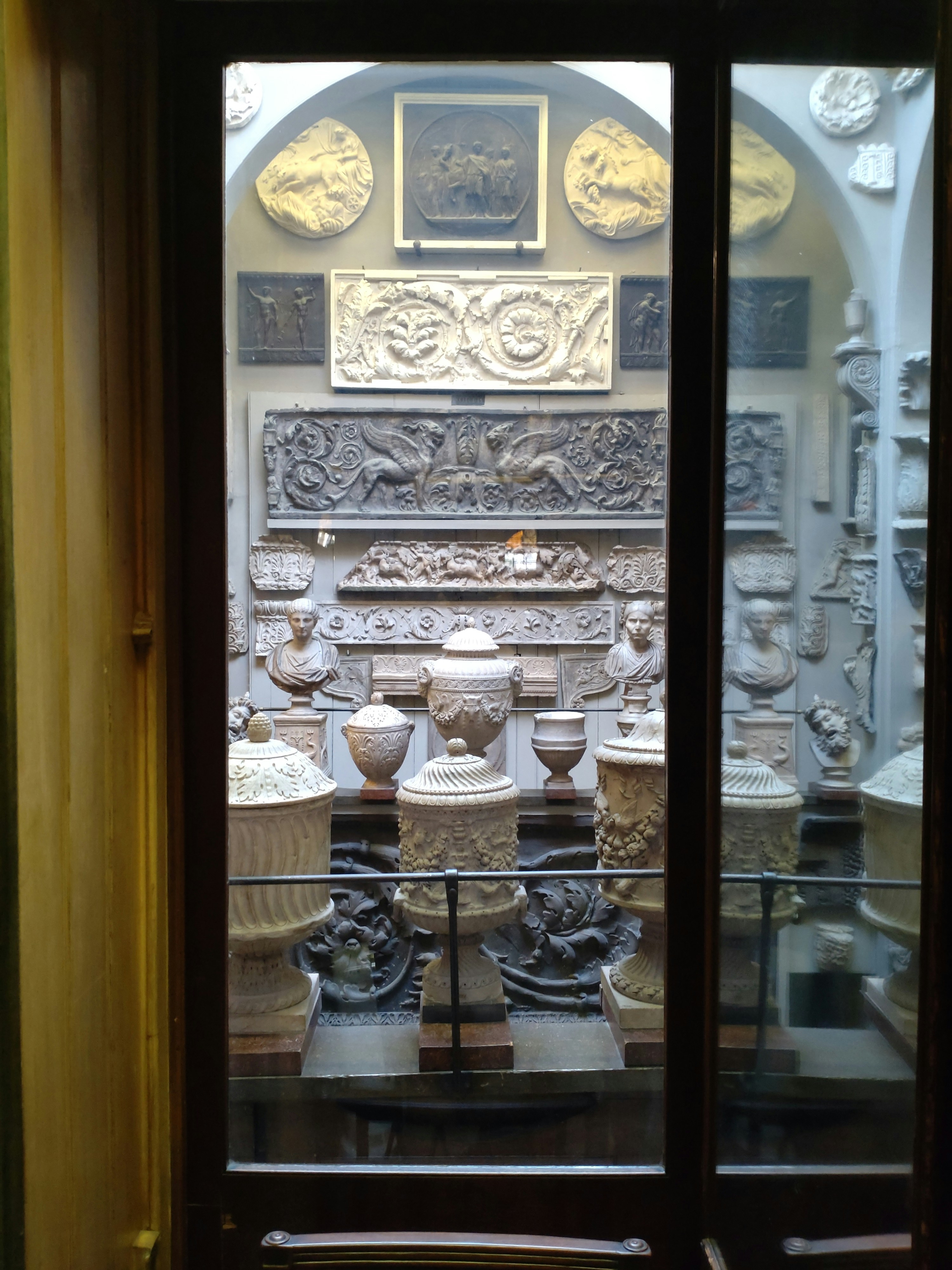 Glass-Guarded Relics: A Shrine of Stone and Ceramics